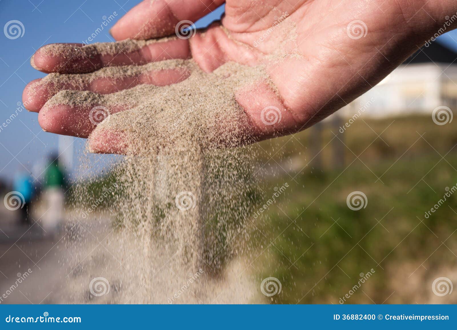 Sand running through hands stock photo. Image of woman - 36882400