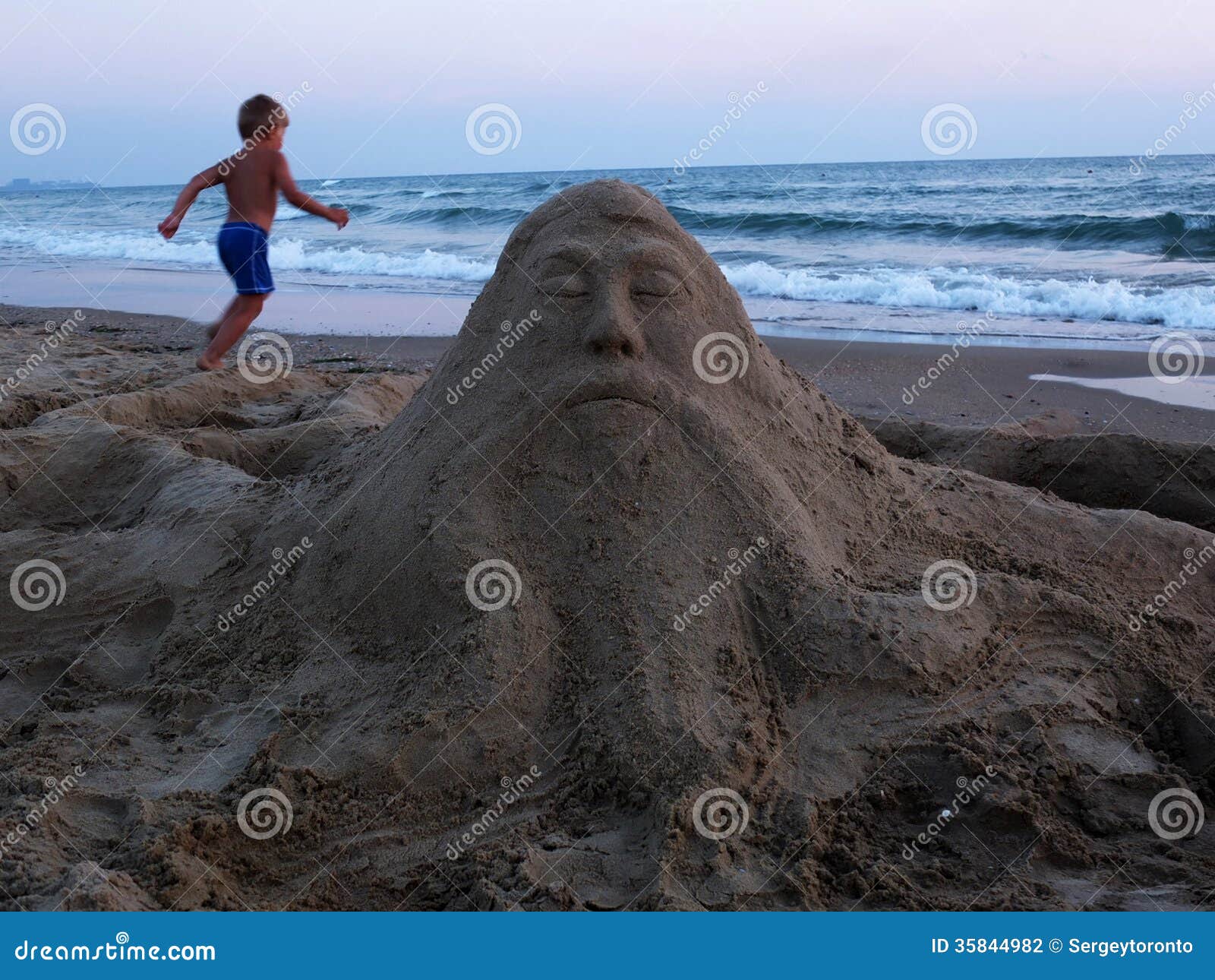 Sand sculpture and boy stock photo. Image of blue, seaside - 35844982