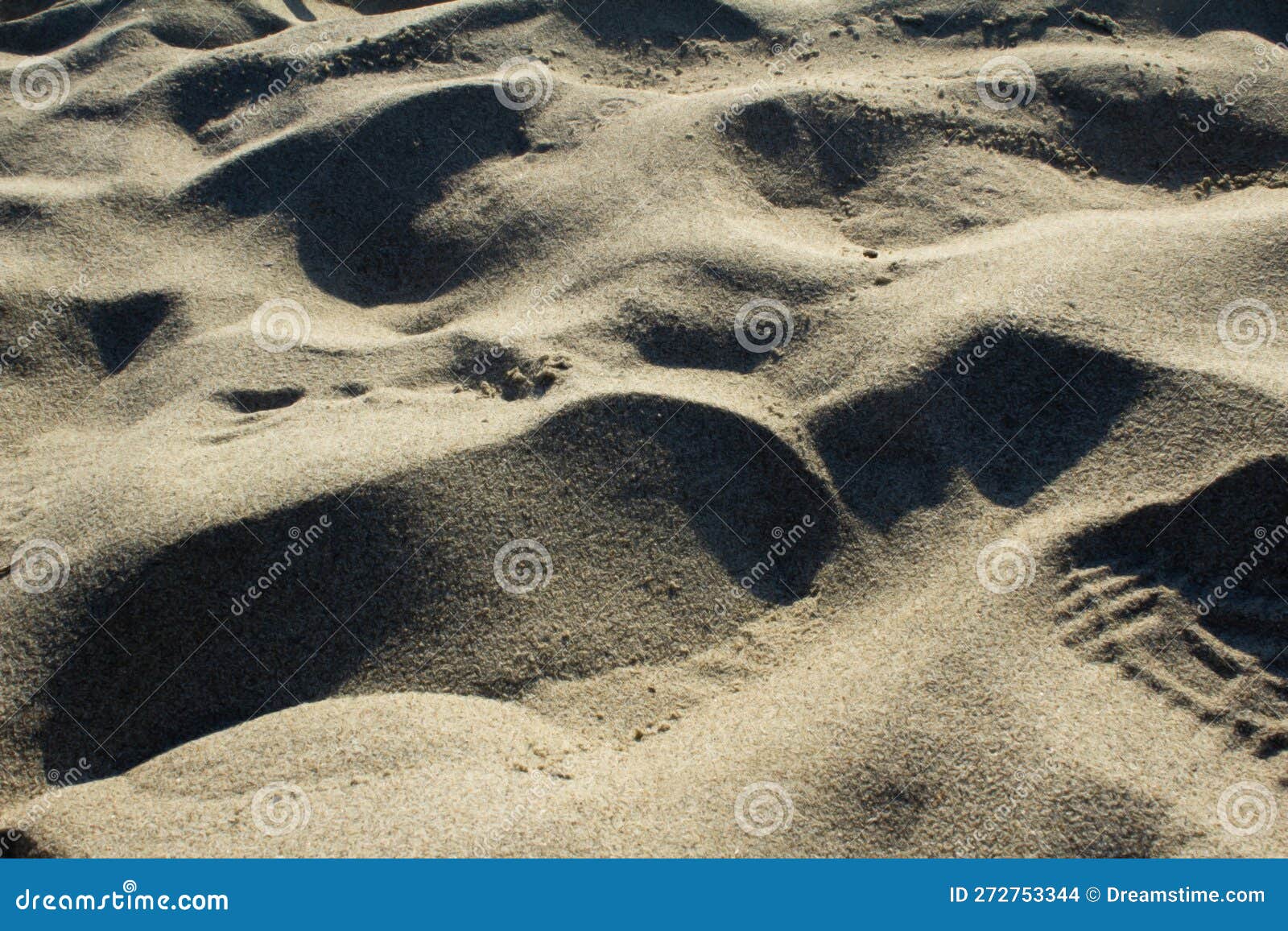 Sand shoe imprints stock photo. Image of brown, shadow - 272753344