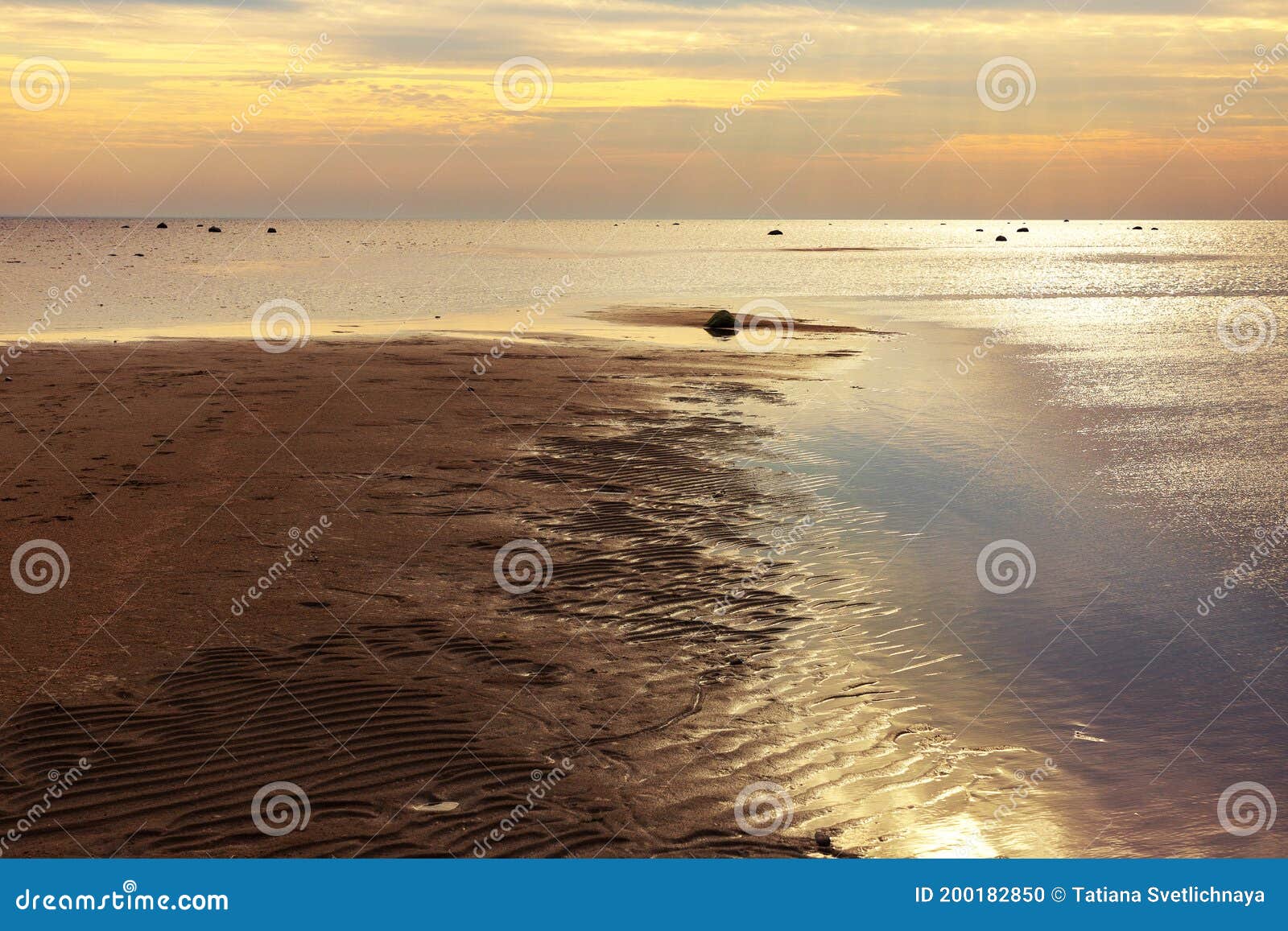 The Sand Spit with Footprints at Sunset Time on the Sea Stock Photo ...