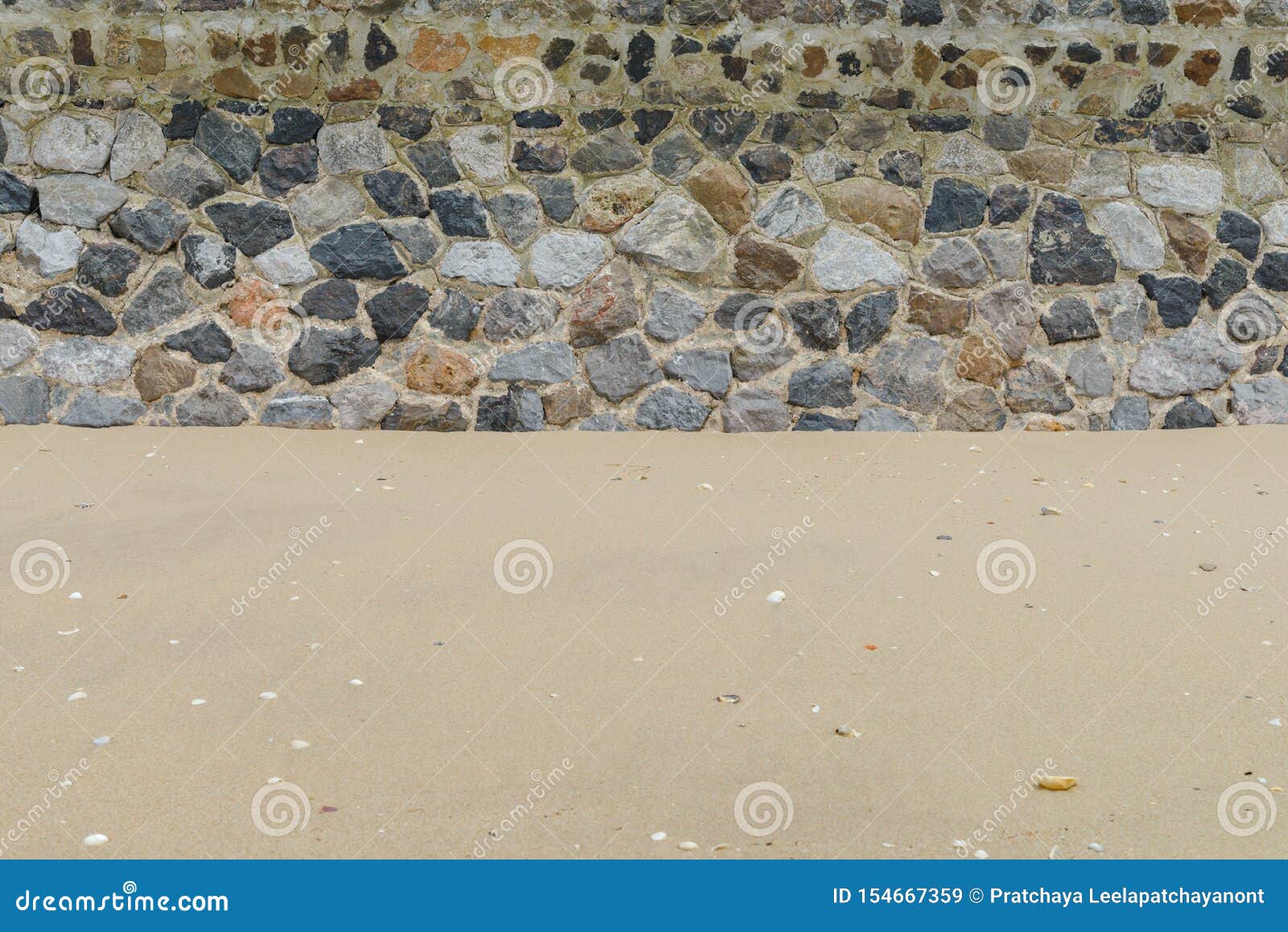 Sand with Stone Wall on the Beach Stock Image - Image of rock ...
