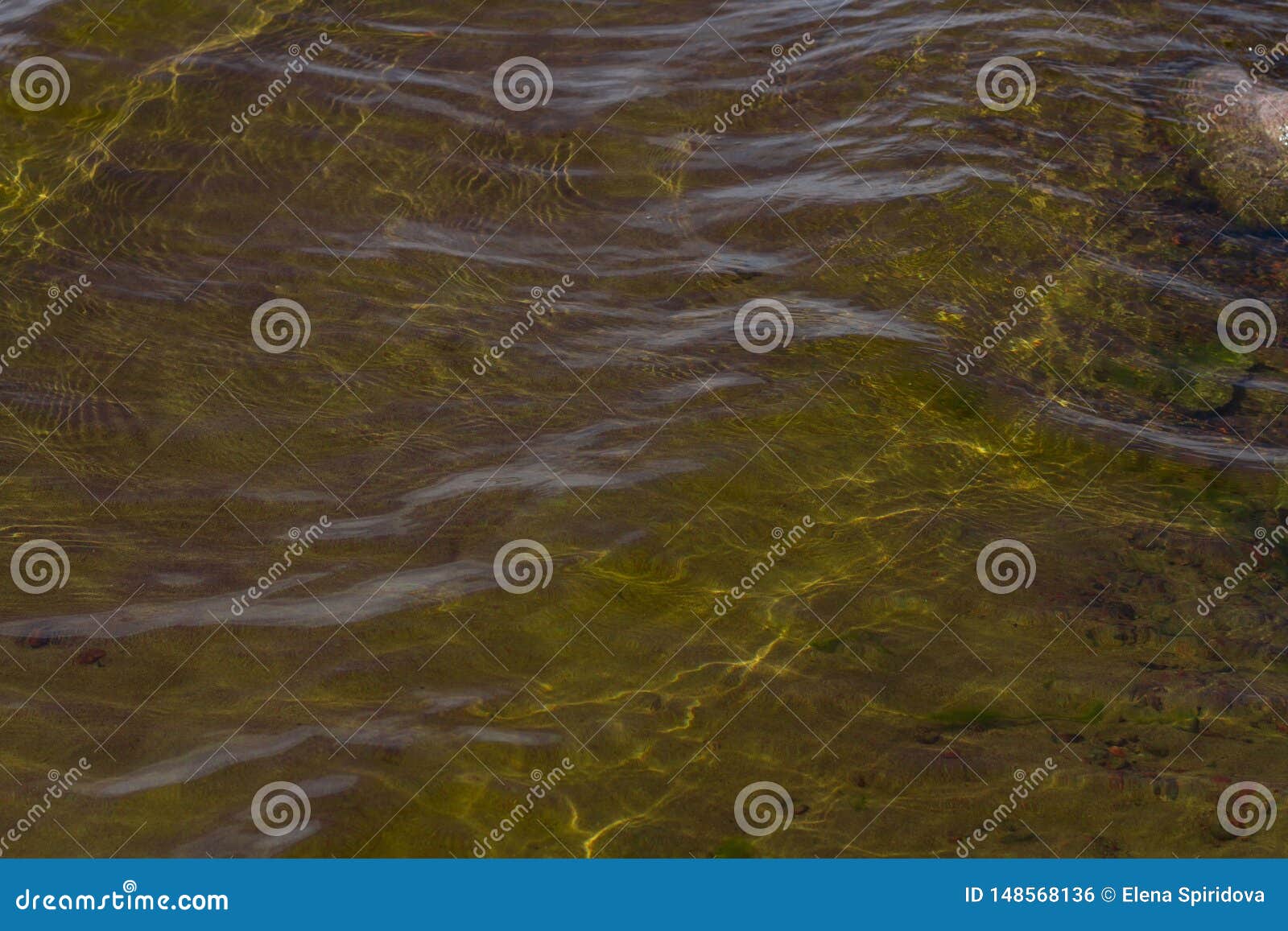 The Sand and Stones Under Water with the Waves in the Foreground Stock ...