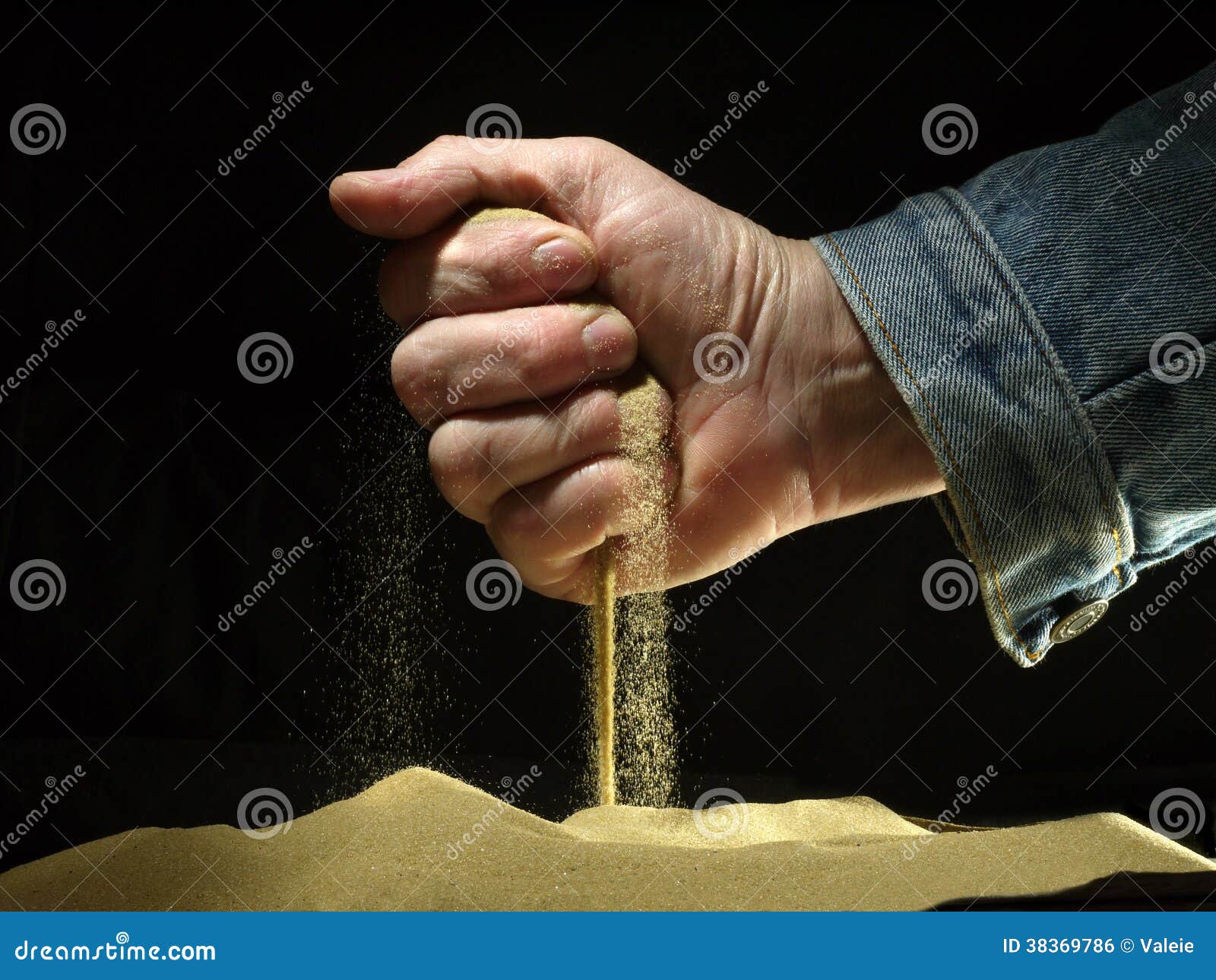 Sand strewed from a fist stock photo. Image of sprinkle - 38369786