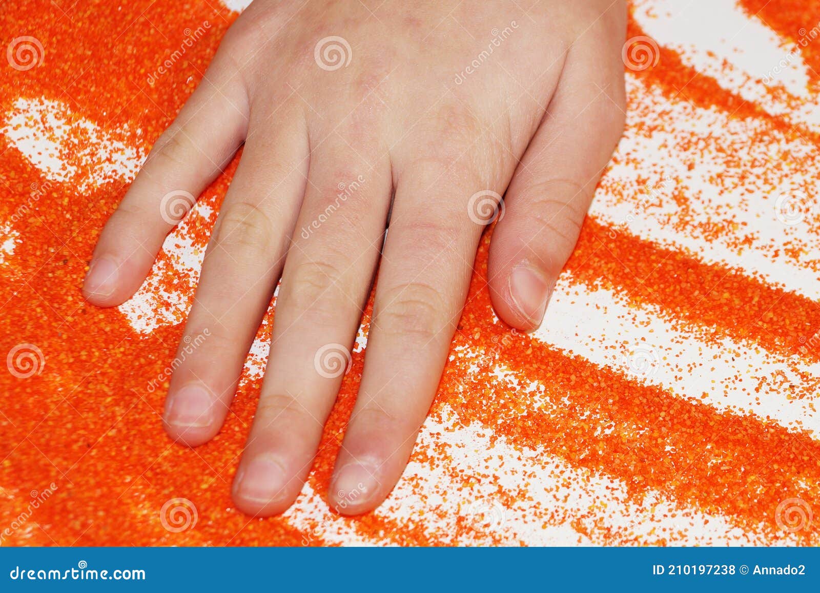 Sand Therapy, Child`s Hand on Orange Kinetic Sand Stock Photo - Image ...