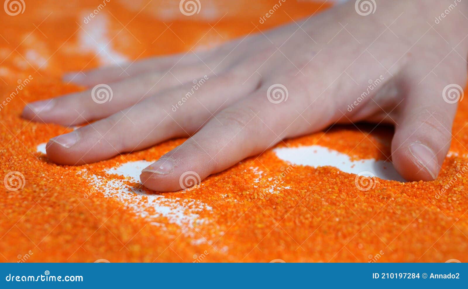 Sand Therapy, Child`s Hand on Orange Kinetic Sand Stock Photo - Image ...