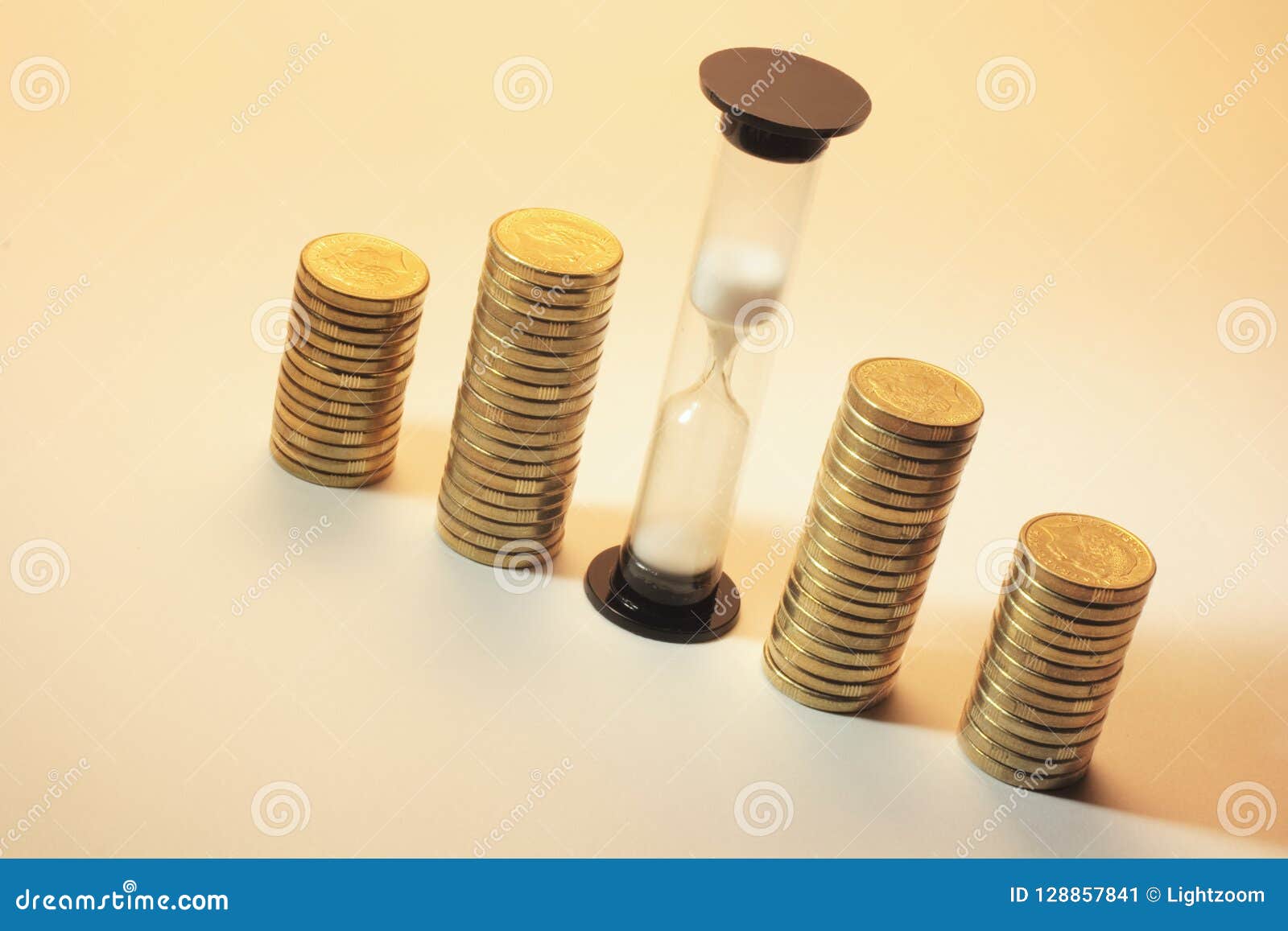 Sand Timer and Coins stock image. Image of reliability - 128857841