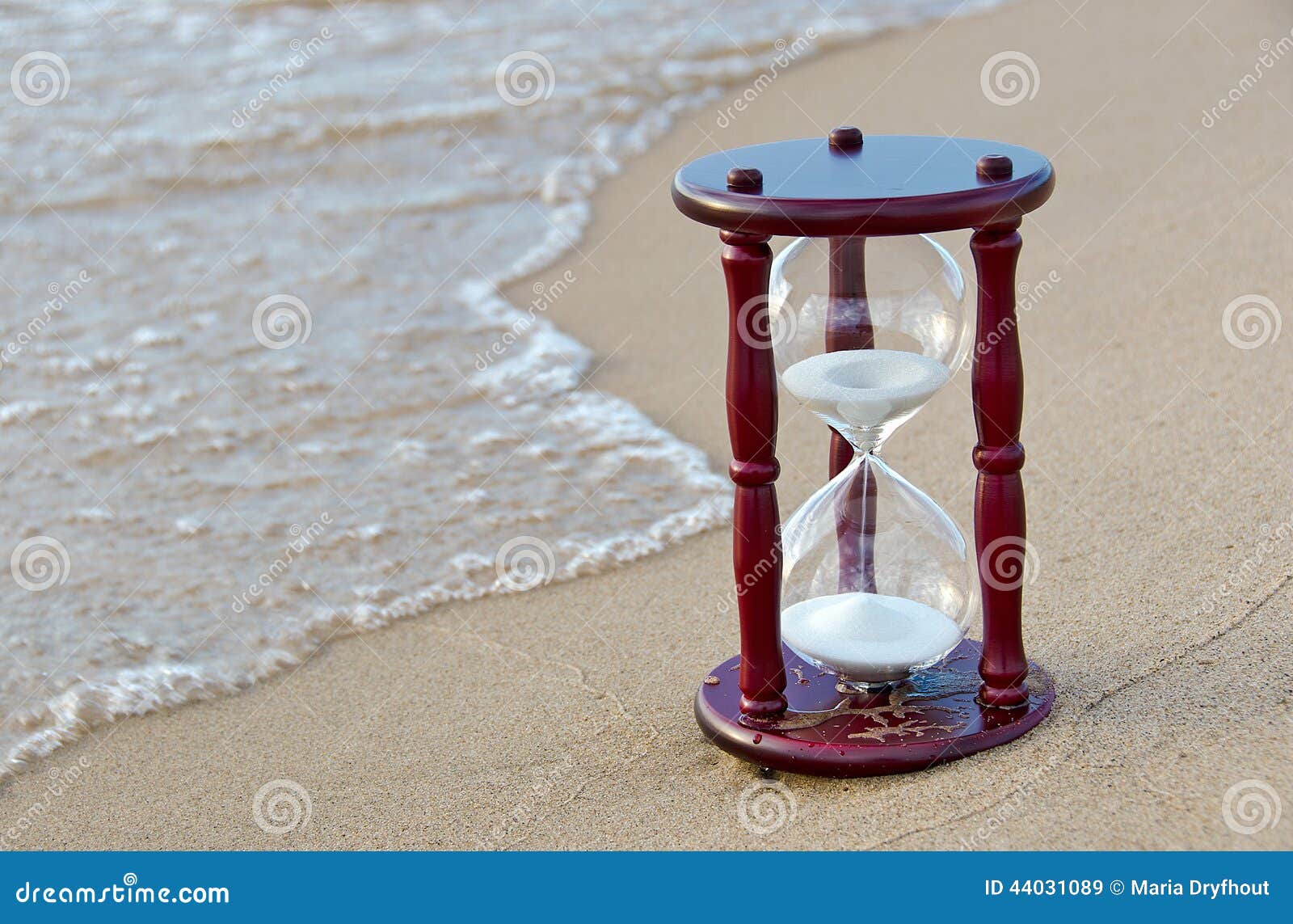 Sand timer on the seashore stock image. Image of hourglass - 44031089