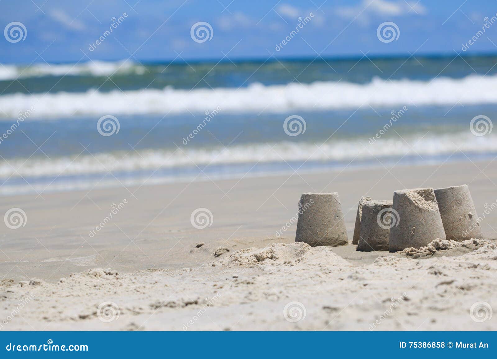 Sand Towers on the Calm Beach. Stock Photo - Image of shore, coastline ...
