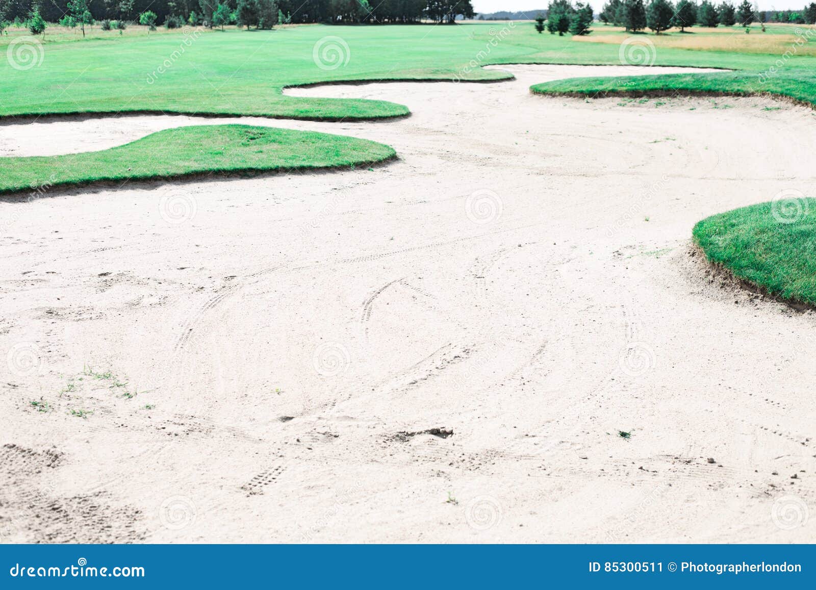 Sand trap at golf course stock image. Image of shape - 85300511