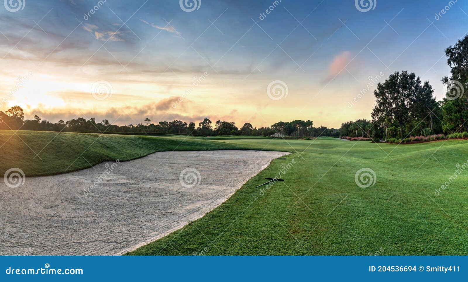 Sand Trap on a Green Golf Course at Sunrise Stock Photo - Image of dawn ...