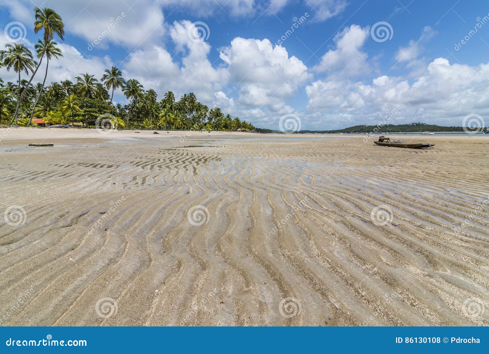 Sand Wave-shaped and Old Raft in a Tropical Beach Stock Photo - Image ...