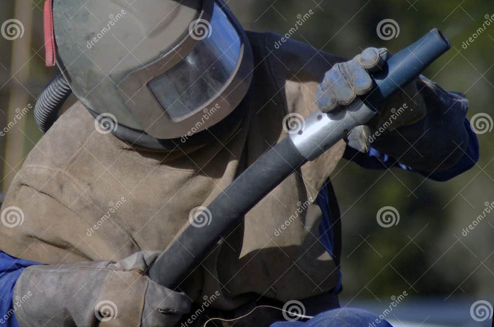 Sandblaster at work stock photo. Image of protecting - 33381462