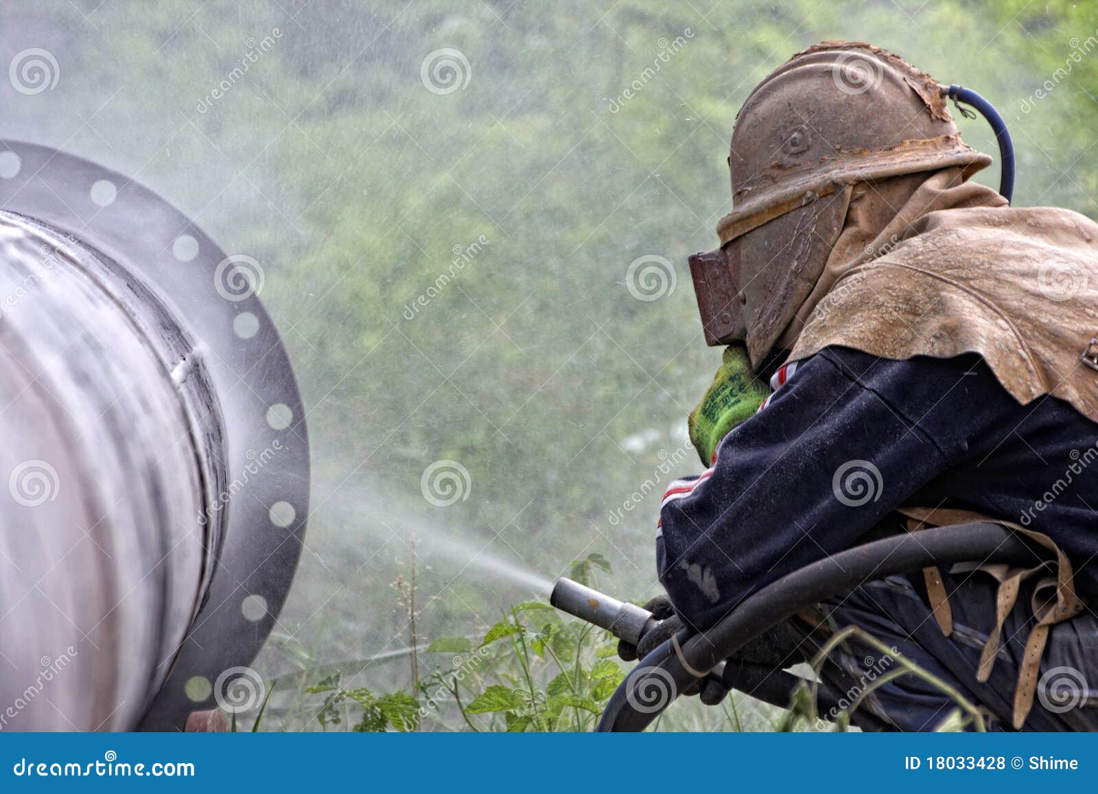 A Construction Sandblasting Machine Stands On A Work Platform For ...