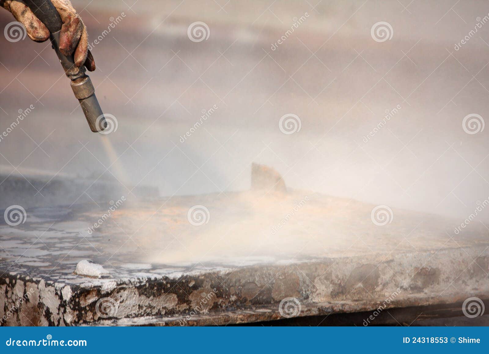 A Construction Sandblasting Machine Stands On A Work Platform For ...