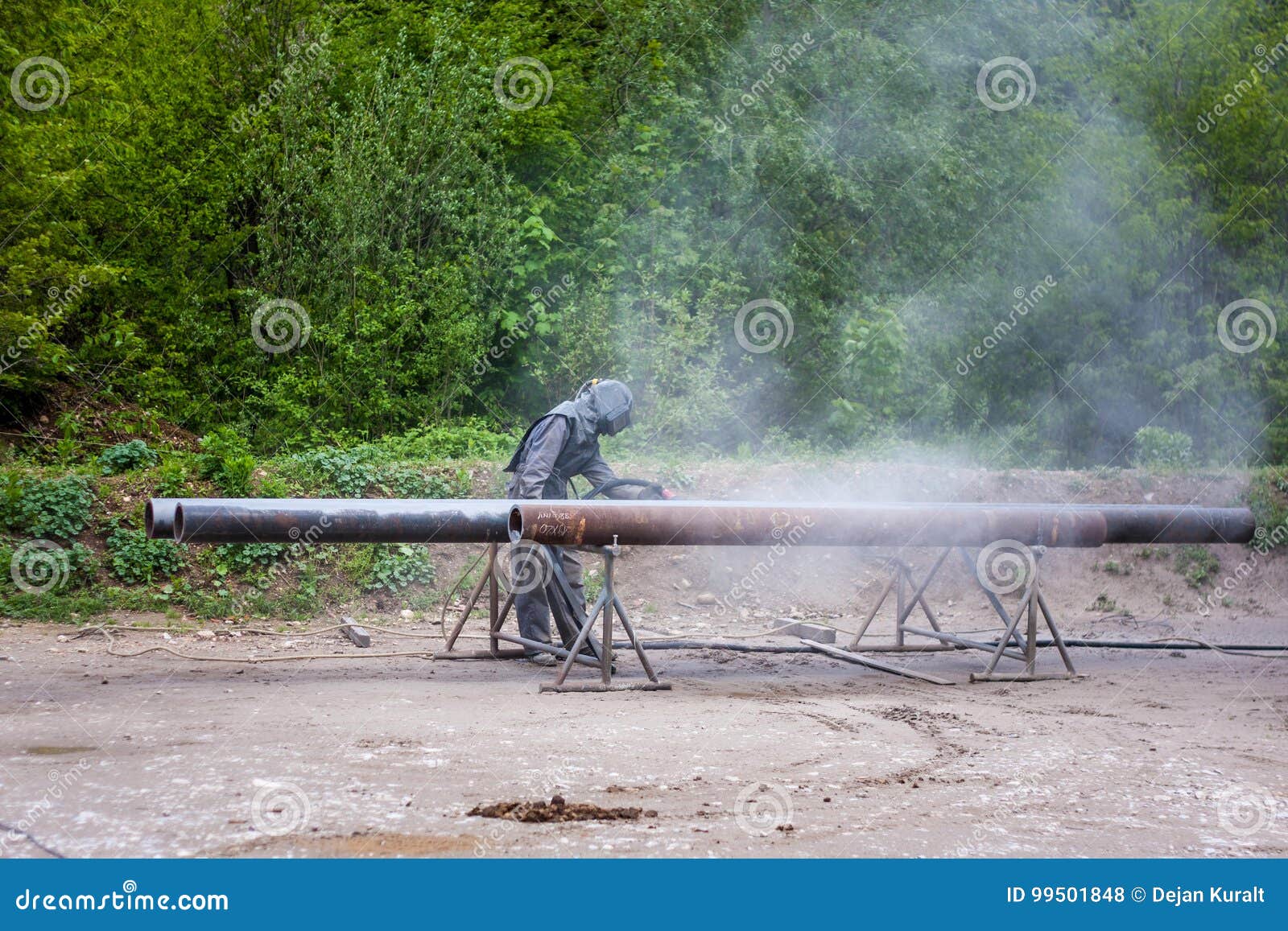 Sandblasting metal pipes stock photo. Image of pipes - 99501848