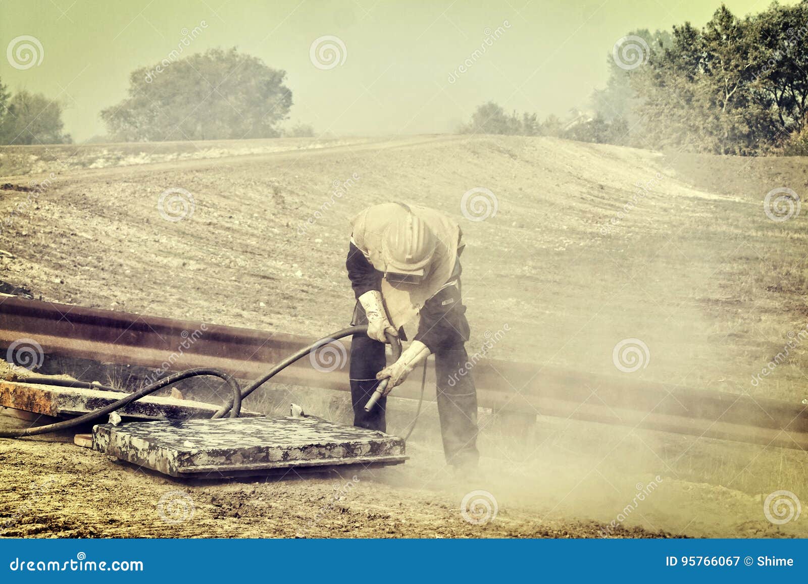 A Construction Sandblasting Machine Stands On A Work Platform For ...