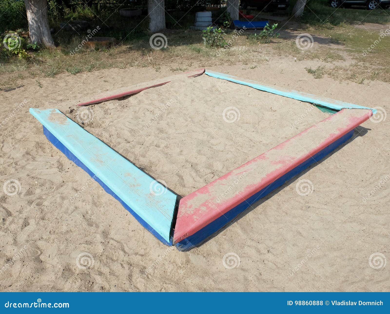 Sandbox on the playground stock photo. Image of grass - 98860888