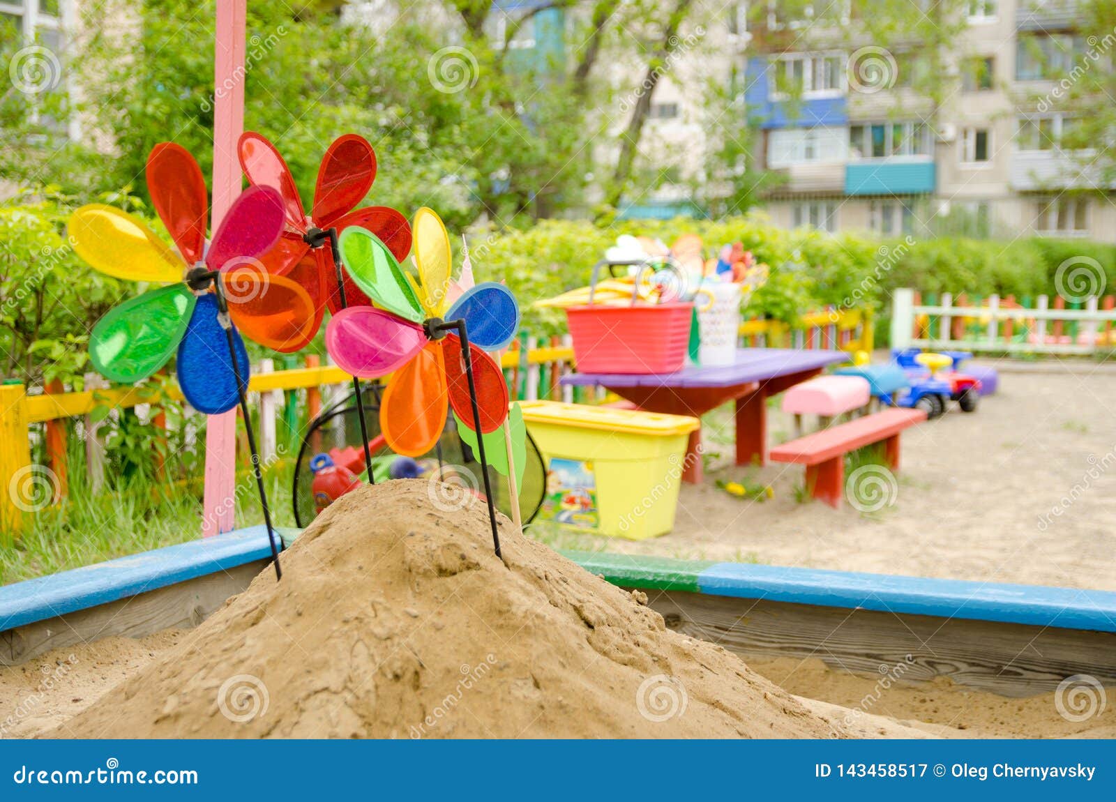 Sandbox with Wind Toys in the Sand on Playground Stock Image - Image of ...