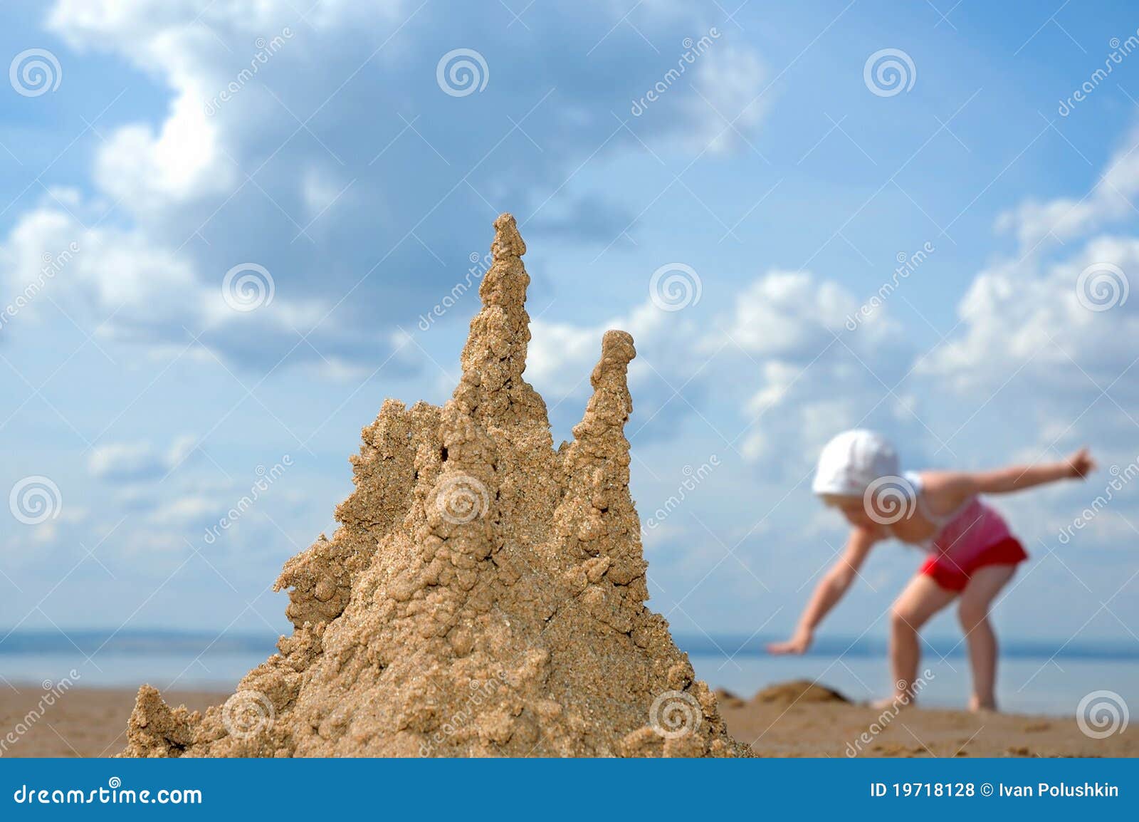 Sandcastle and Playing Child Stock Photo - Image of play, beach: 19718128
