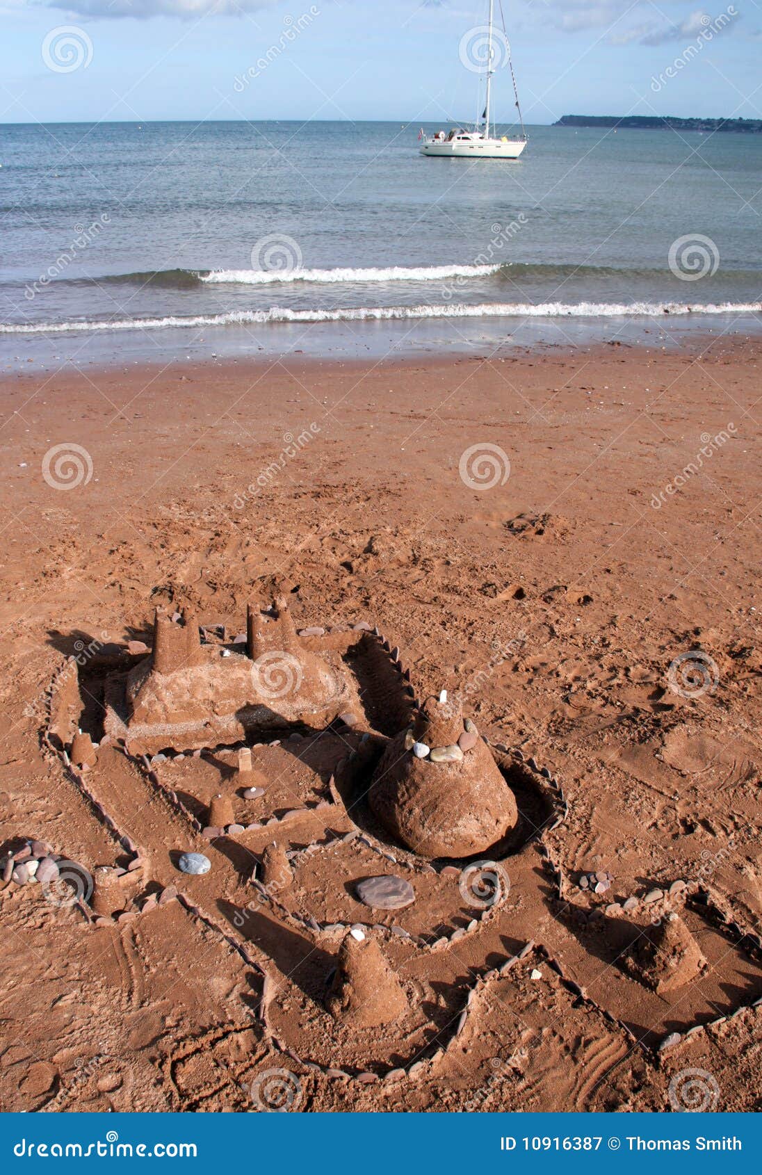 Sandcastle and Sailing Boat Stock Image - Image of tourist, weather ...