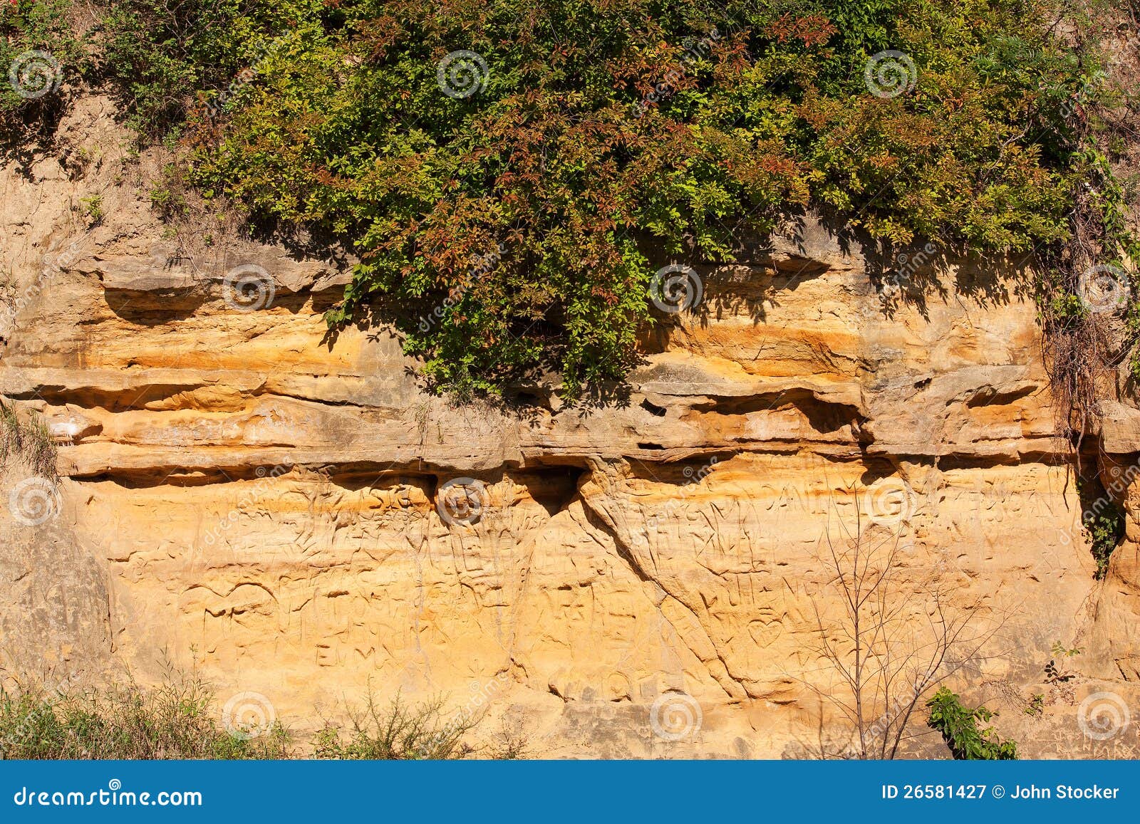 Sandstone Cliff Face with Carvings Stock Image - Image of cliff, rock ...