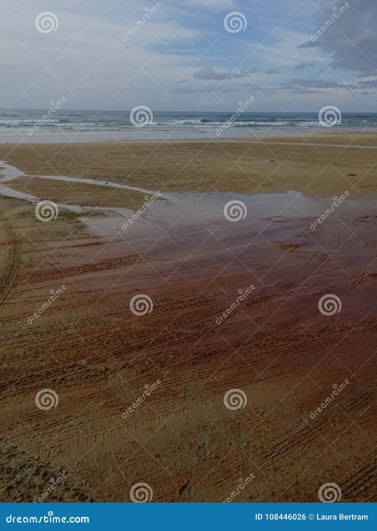 Sandtracks on the beach stock photo. Image of blue, unfiltered - 108446026