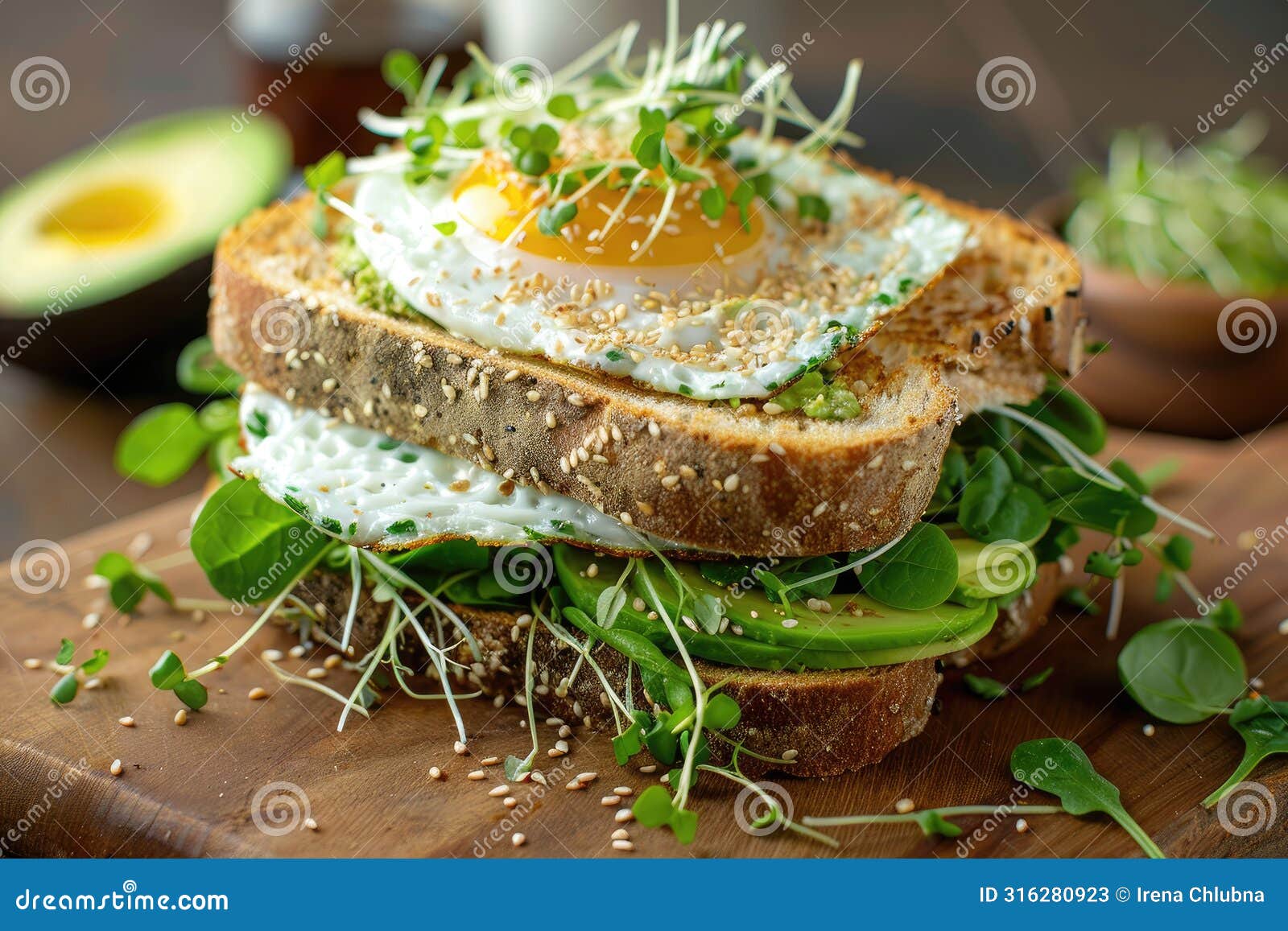 Sandwich with Avocado Egg Spinach Microgreens and Sesame Stock ...