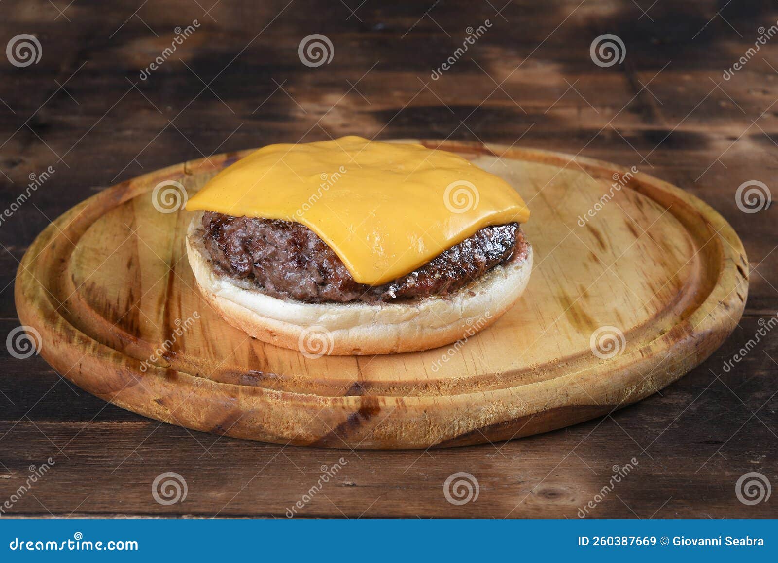 Sandwich Bread Cut in Half with Meat and Cheese Burger on Top Stock ...