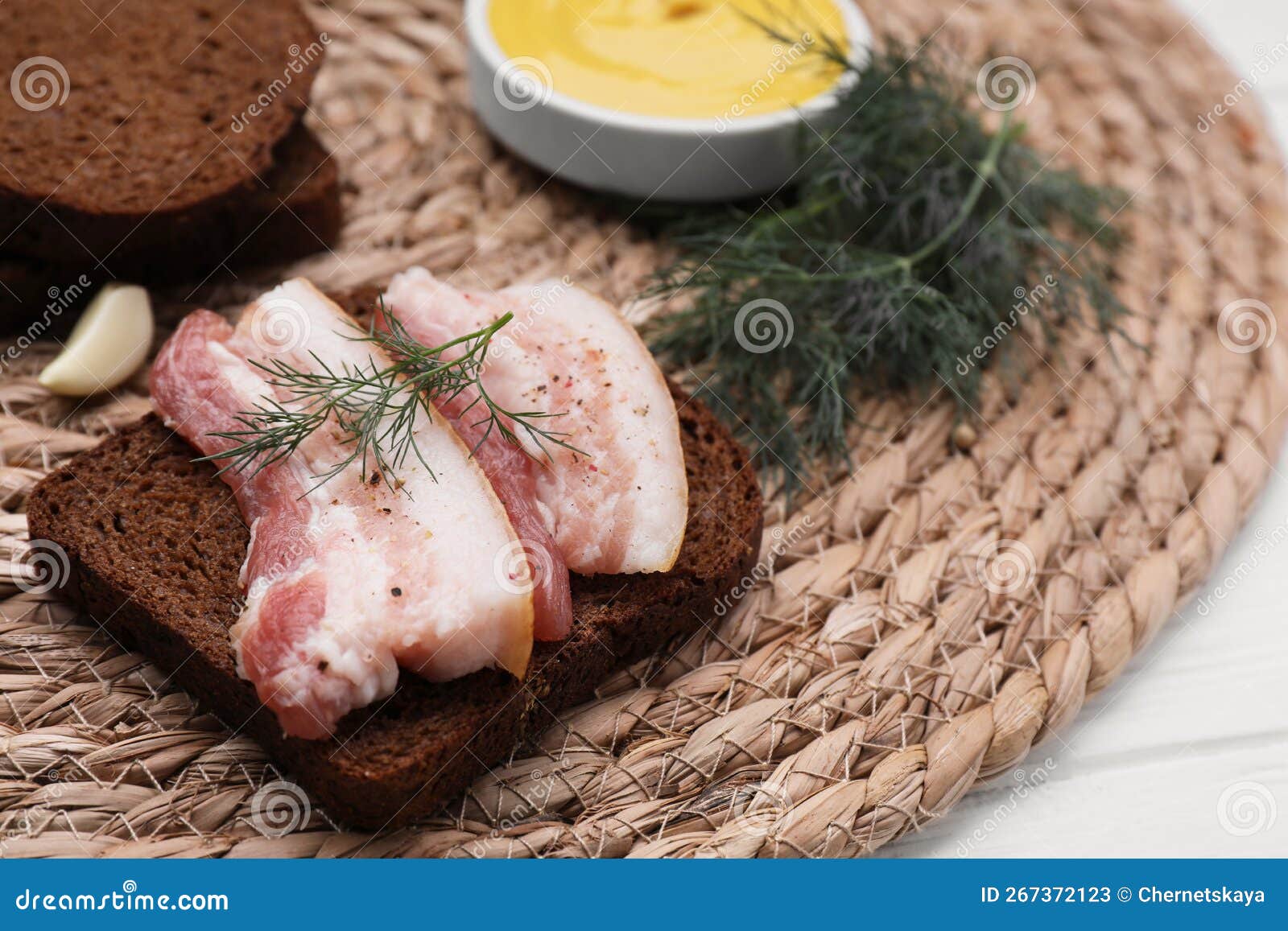Sandwich with Pork Fatback on Wicker Mat, Closeup Stock Image - Image ...