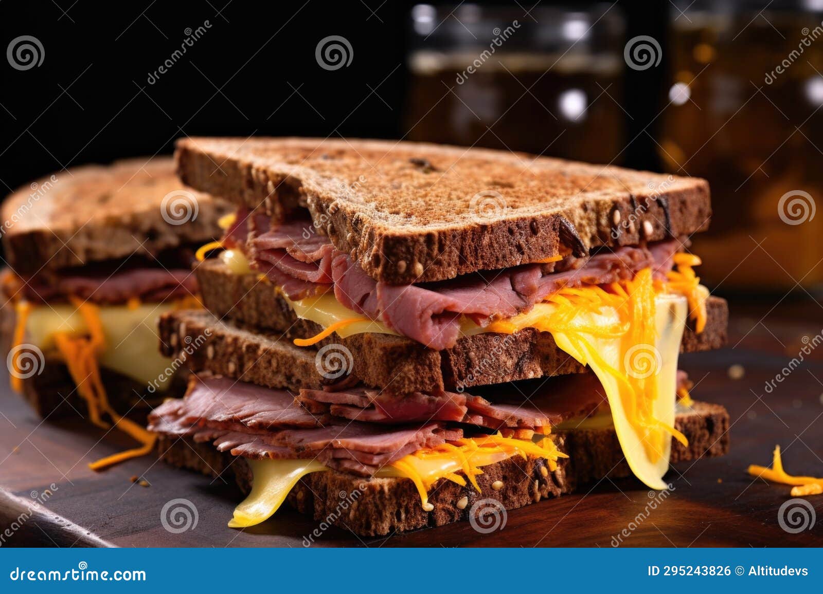 Sandwich of Thin-sliced Roast Beef and Cheddar on Dark Rye Stock Photo ...