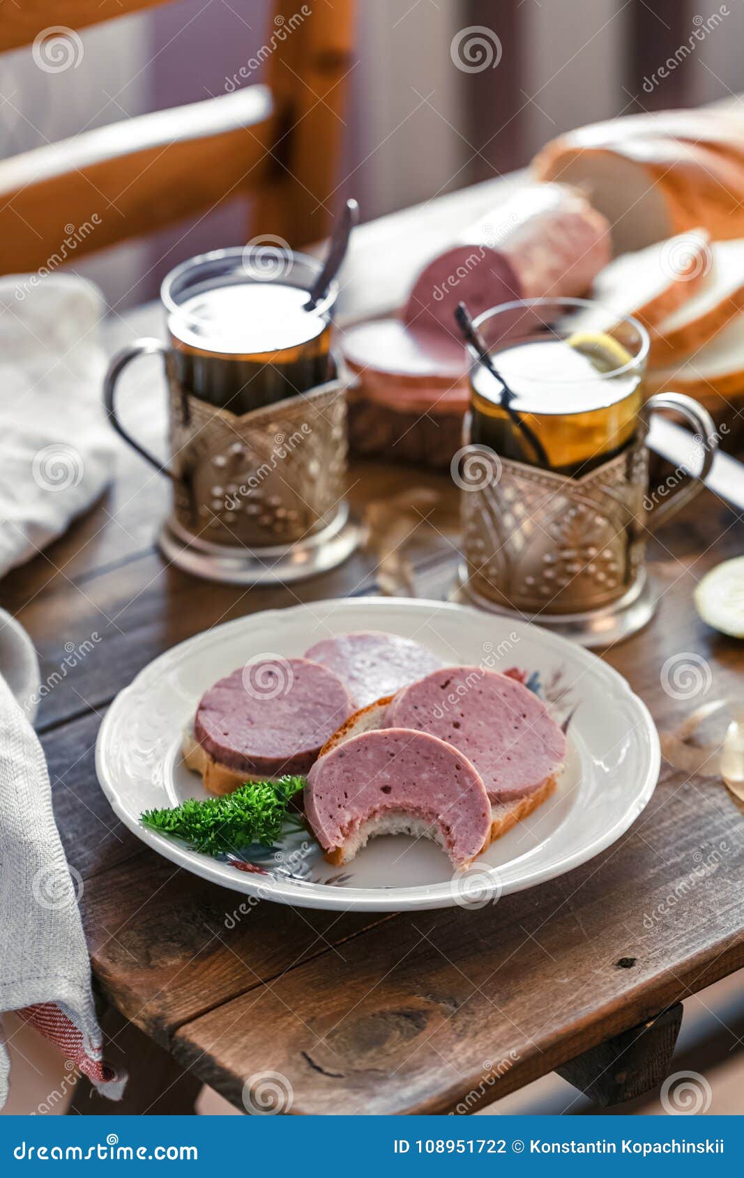 Sandwiches with Sliced Sausage on a Plate with Tea Stock Photo - Image ...