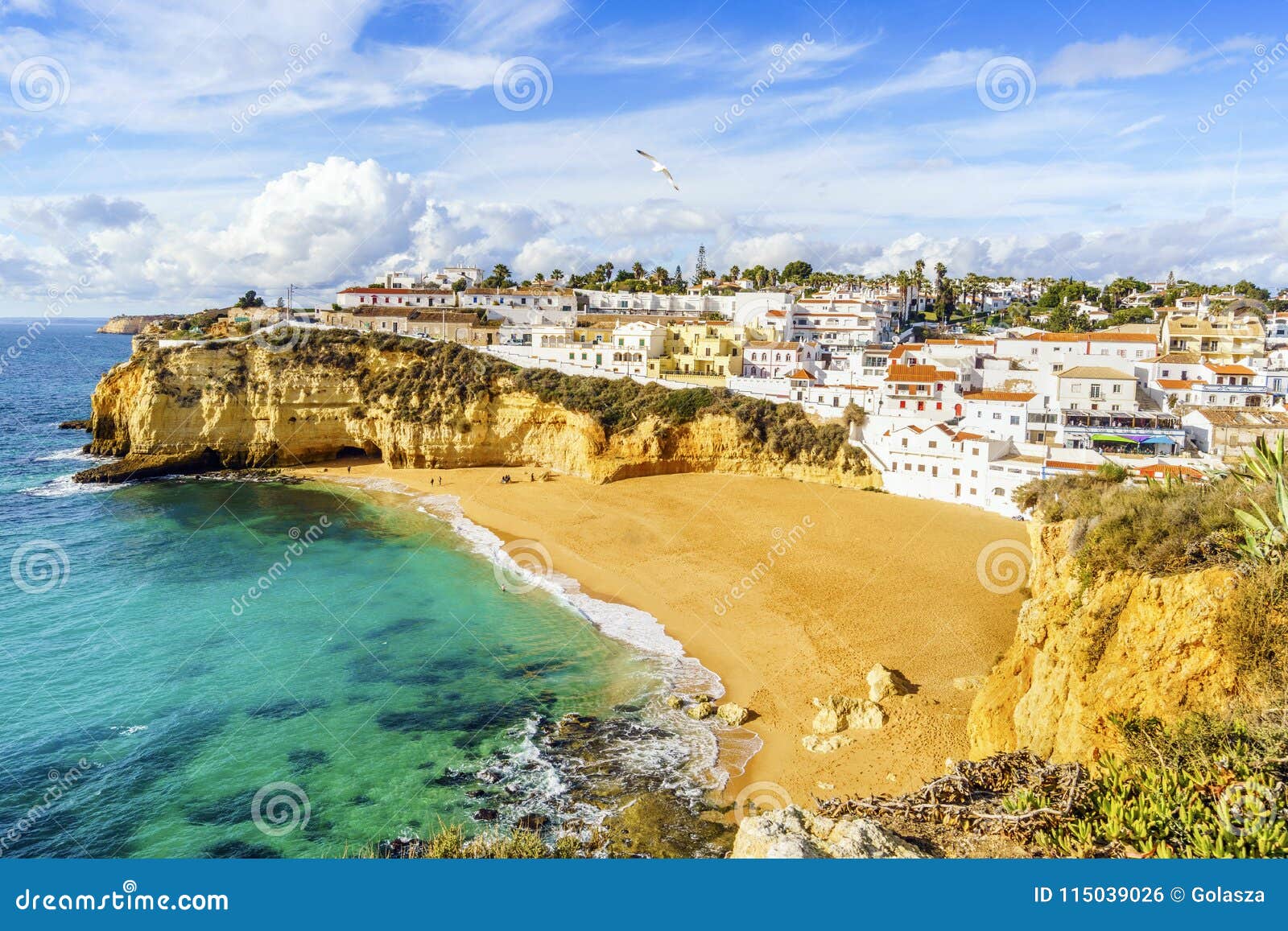 Sandy Beach between Cliffs and White Architecture in Carvoeiro, Stock ...