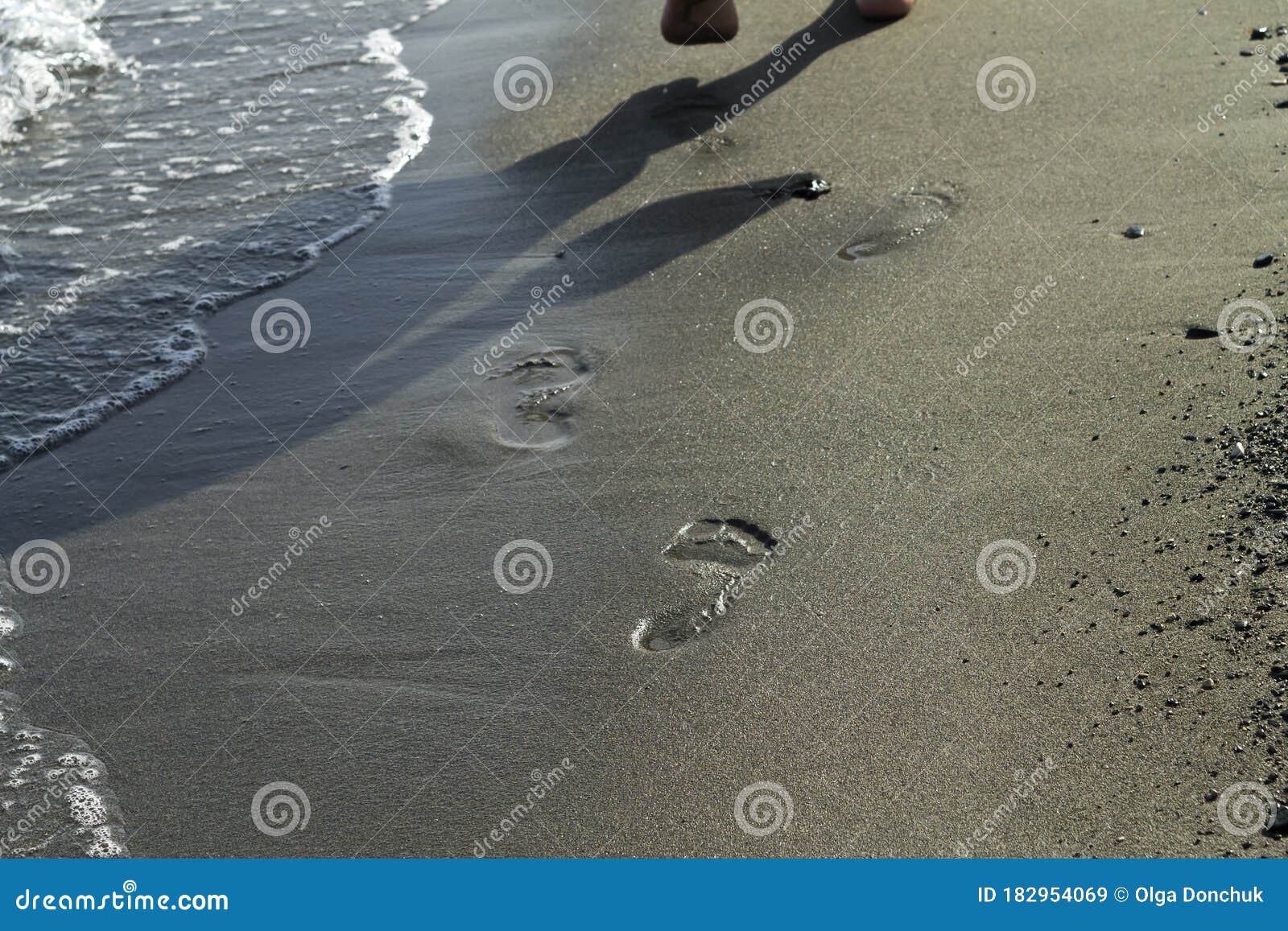 Sandy Beach with Footprints and Human Shadow Stock Image - Image of ...