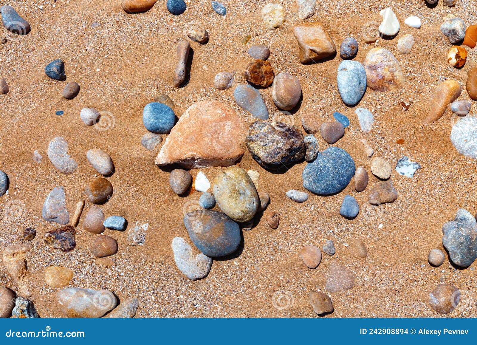 Sandy Beach with the Multicolor Pebbles on the African Atlantic Ocean ...