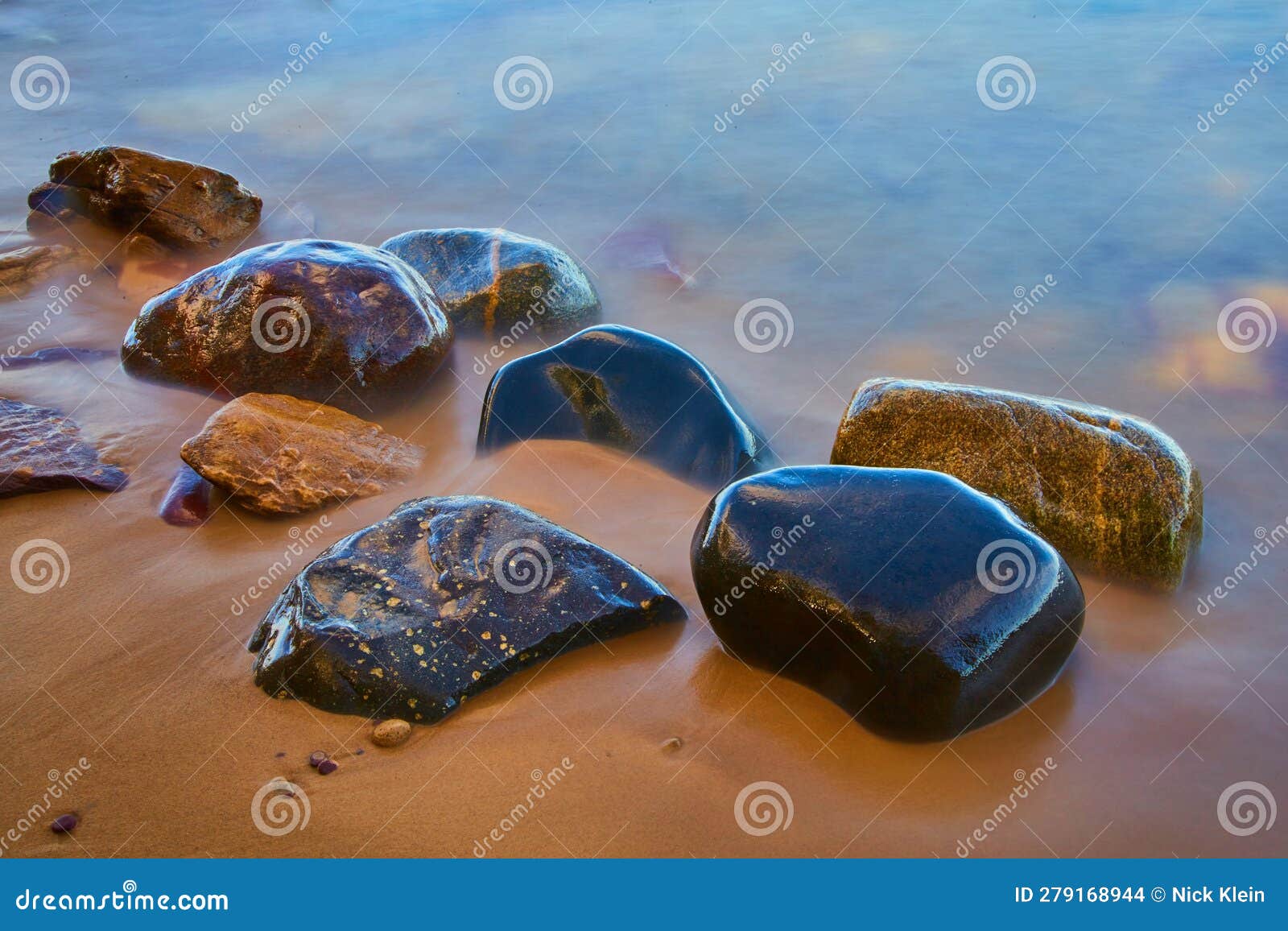 Sandy Beach Shore with Smooth Wet Rocks of Precious Stones Washed ...
