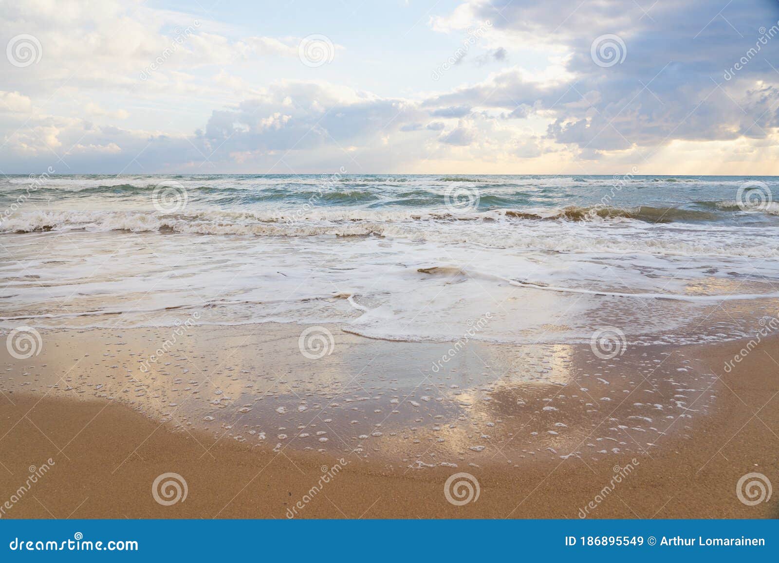 Sandy Beach on a Sunset with Reflection on Wet Sand and Waves with Foam ...