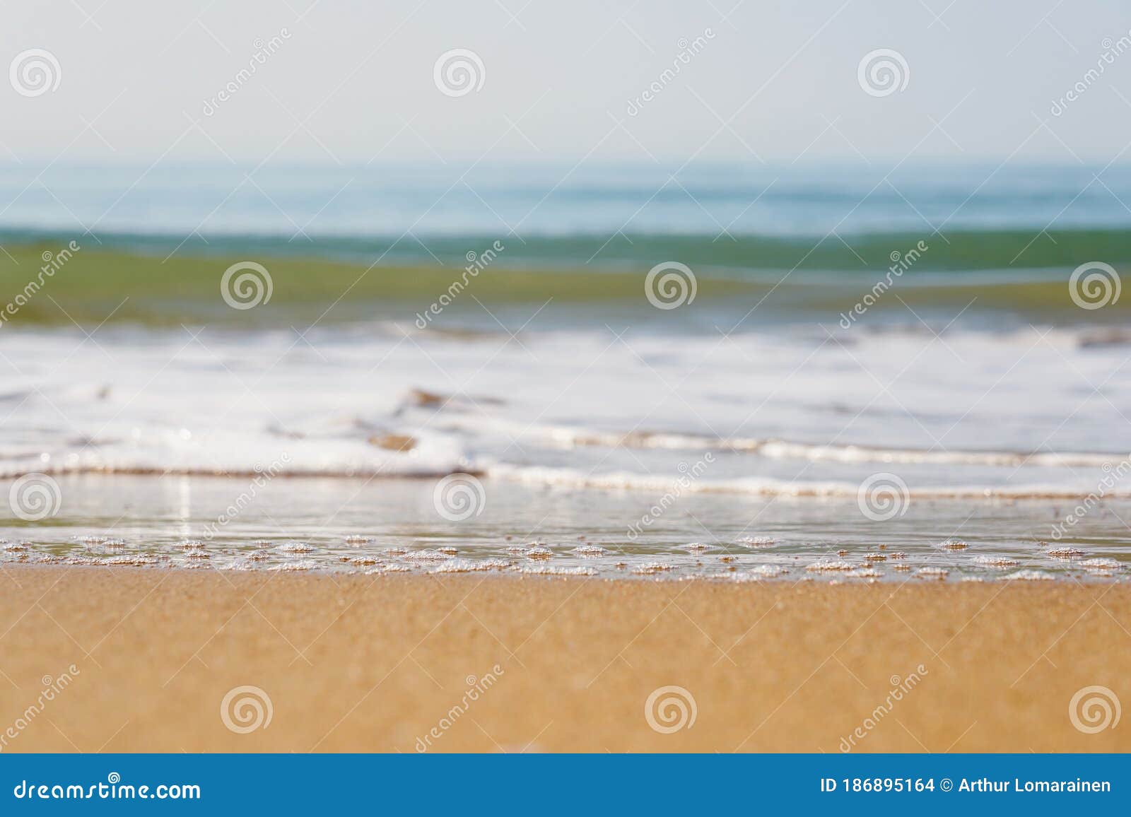 Sandy Beach on a Sunset with Reflection on Wet Sand and Waves with Foam ...