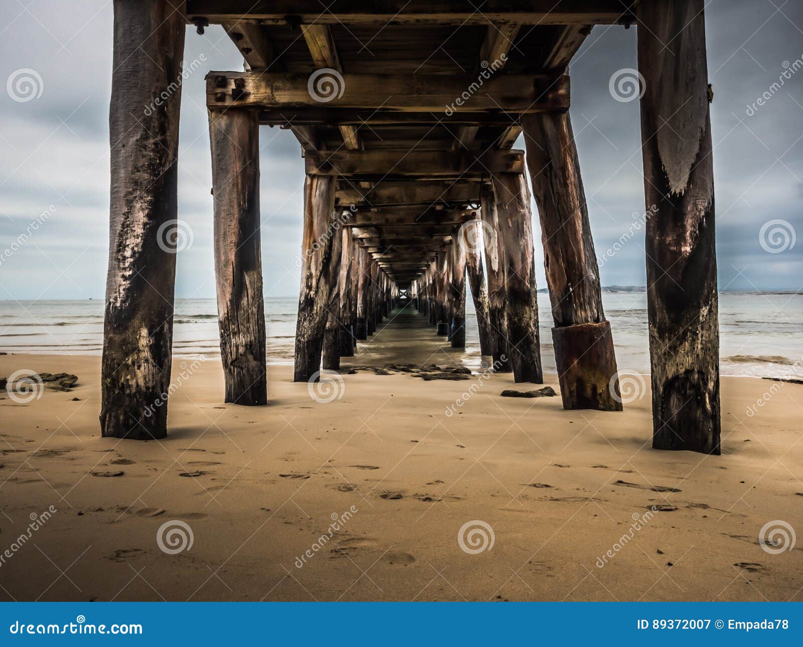 Sandy Beach Under a Pier or Jetty Stock Image - Image of dock, nature ...