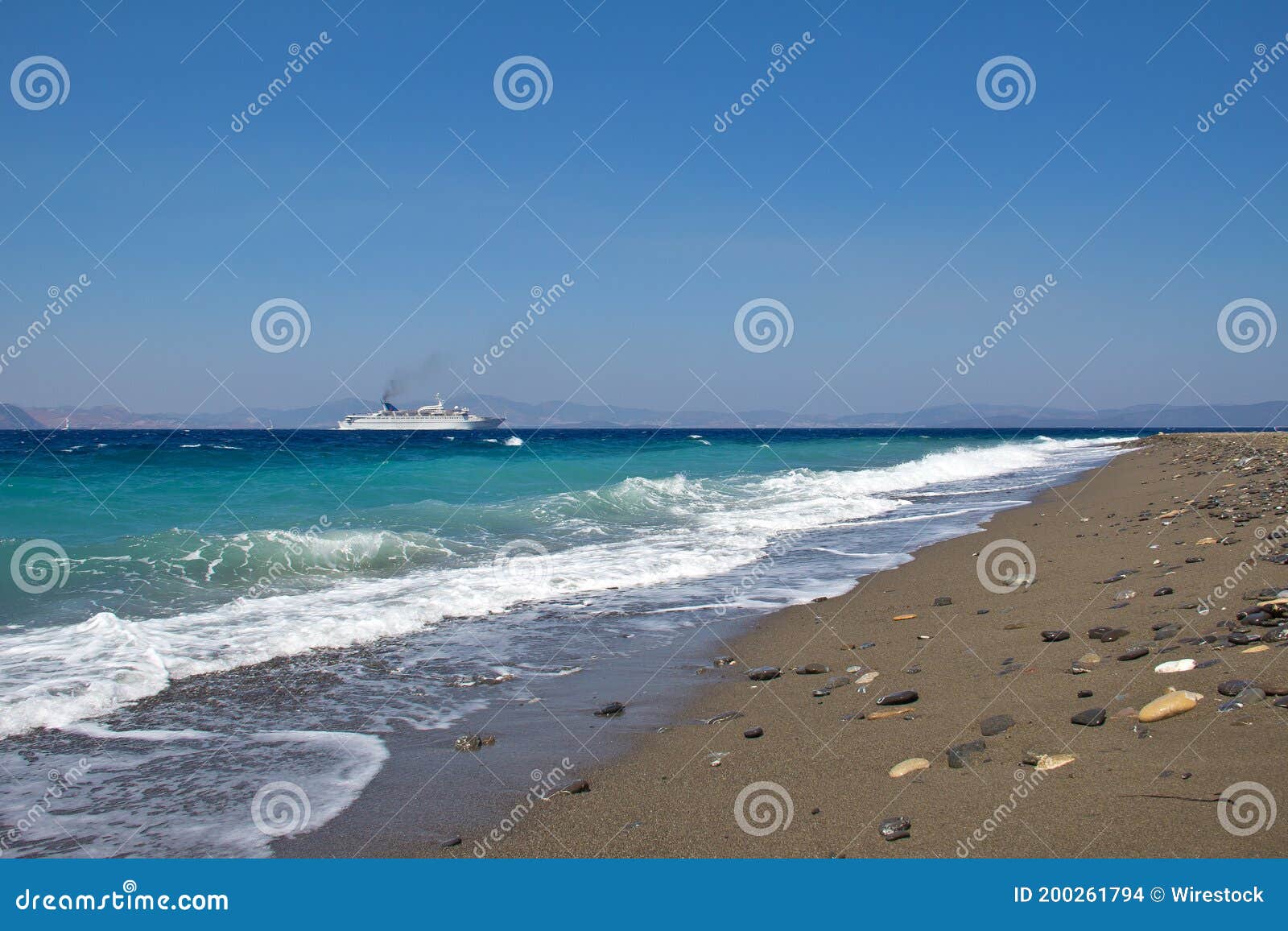Sandy Beach and Wavy Sea with a Ship Stock Photo - Image of sunny ...