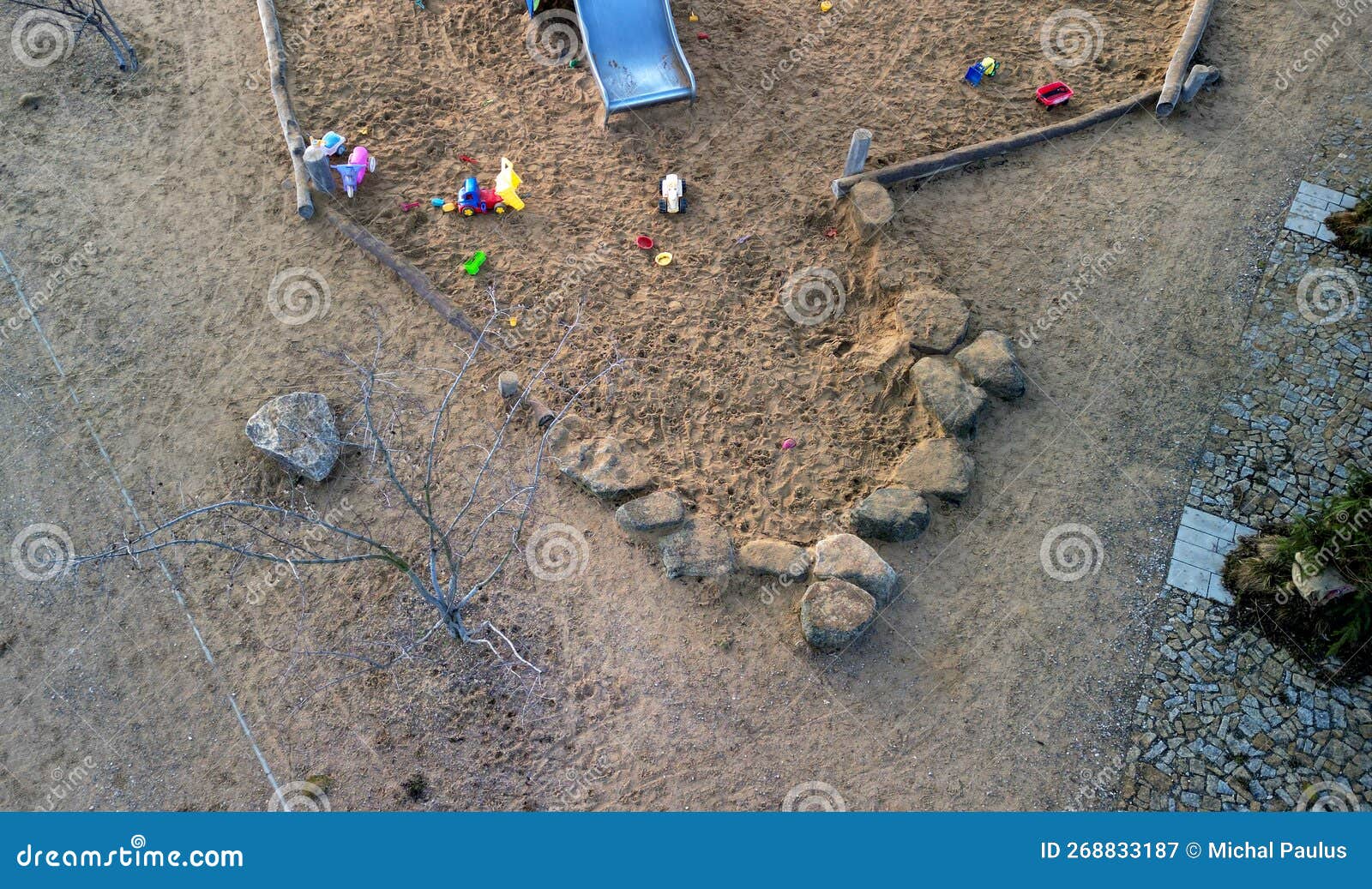 Sandy Children Playground Bordered by Tree Trunks and Stock Image ...