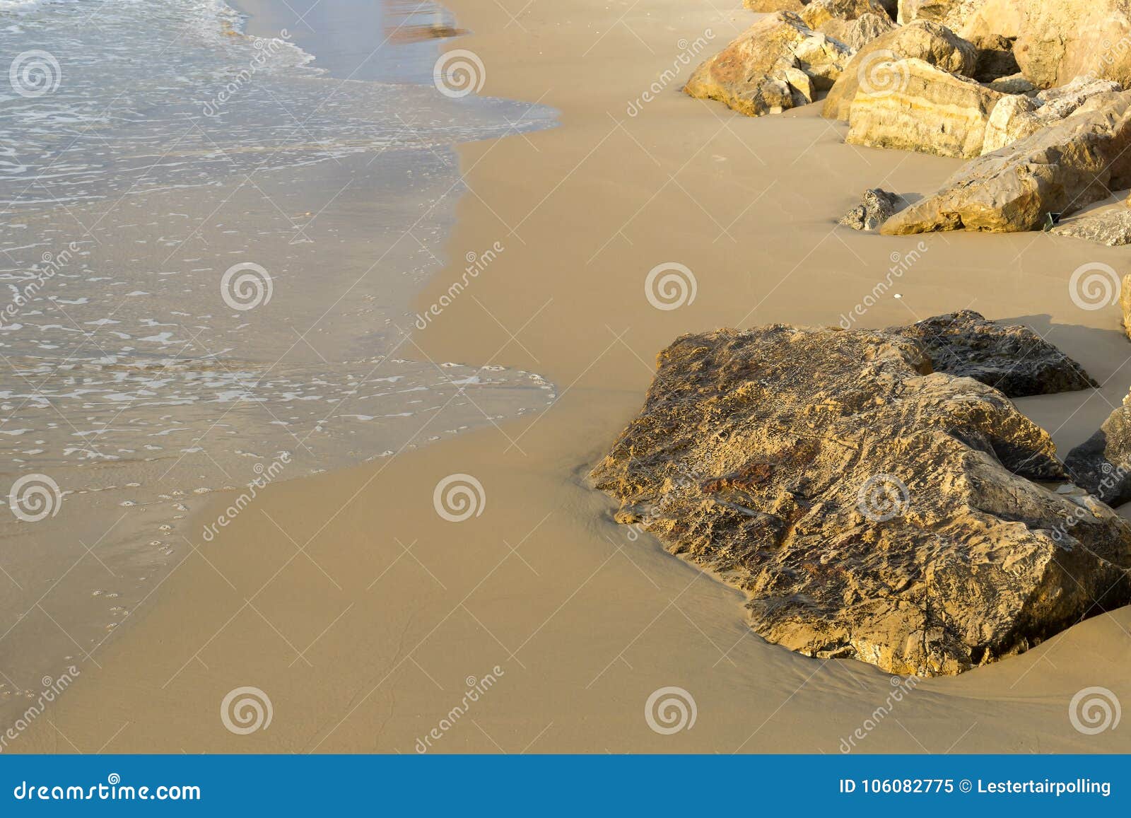 Sandy sea beach with rocks stock image. Image of sand - 106082775