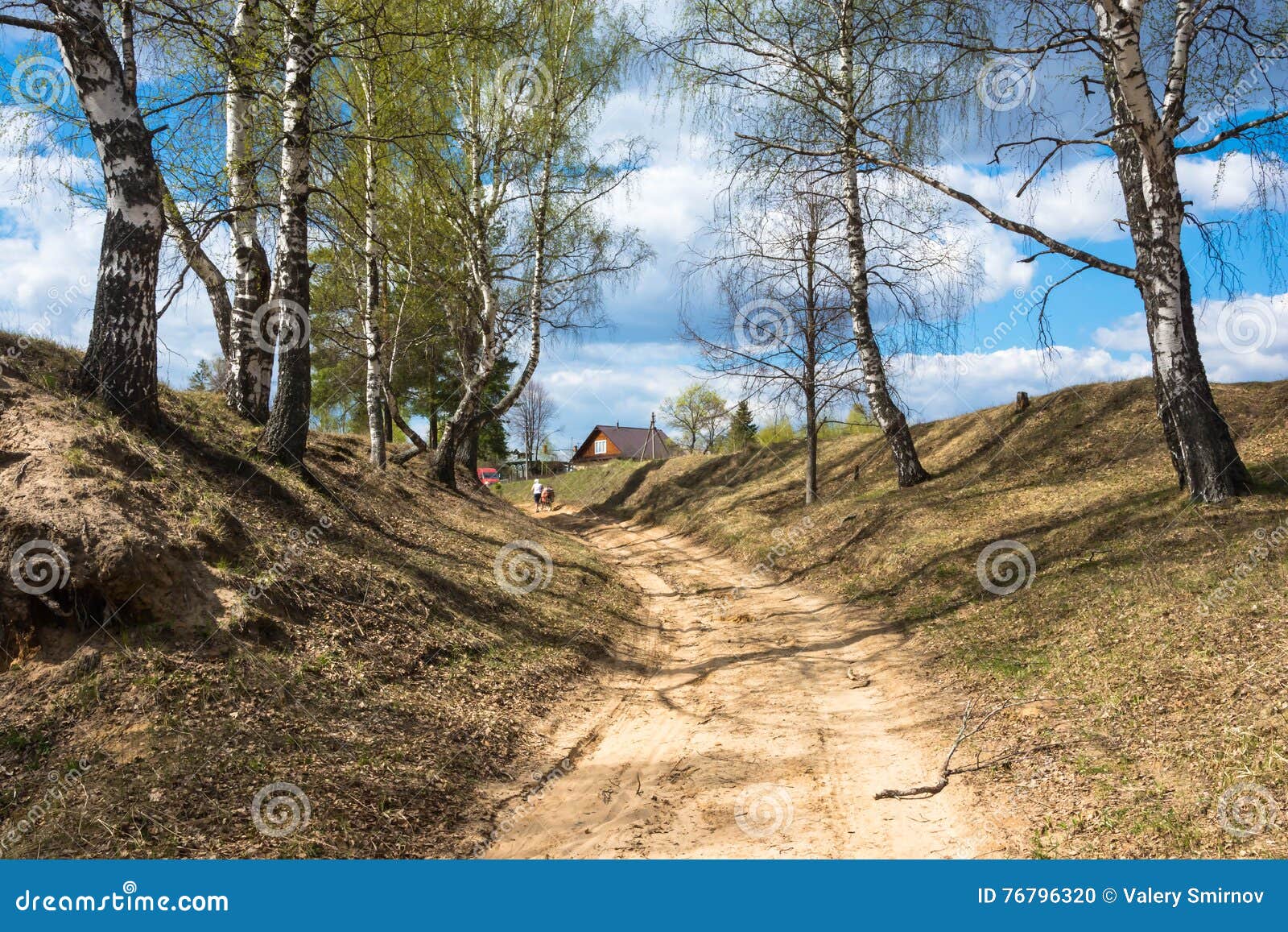 Sandy village road. stock photo. Image of rural, clouds - 76796320