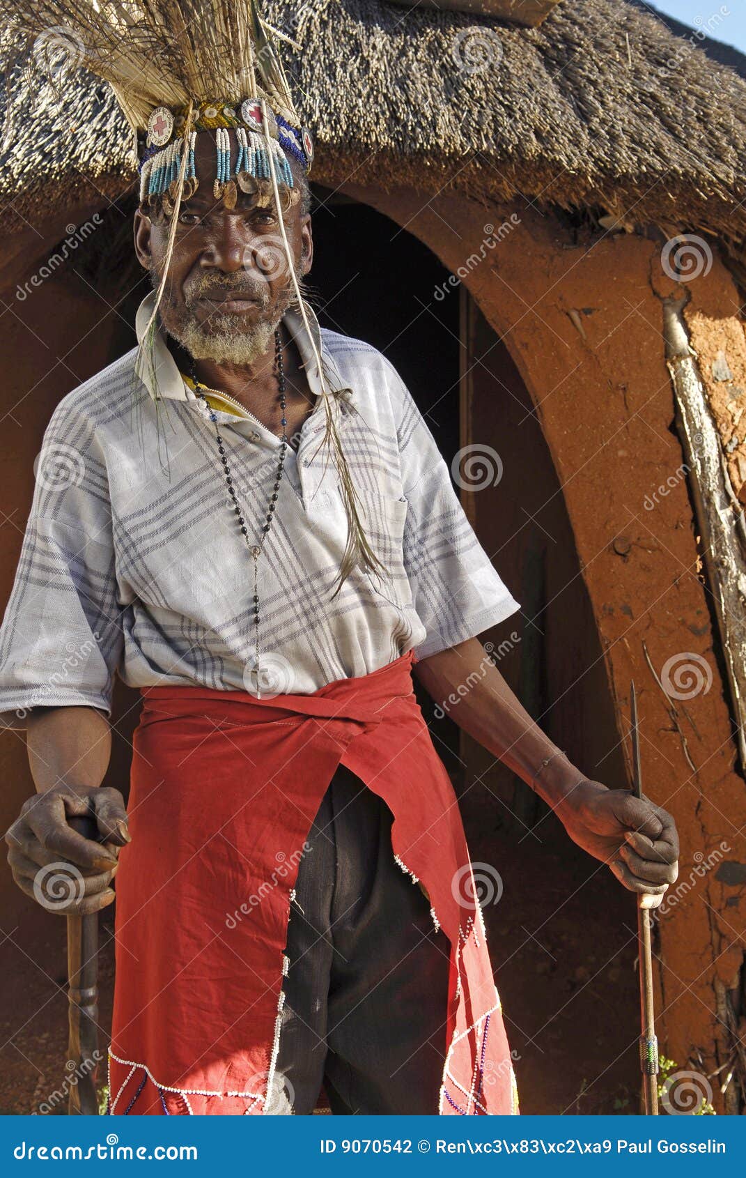 Sangoma Pitso and rondavel stock photo. Image of work - 9070542