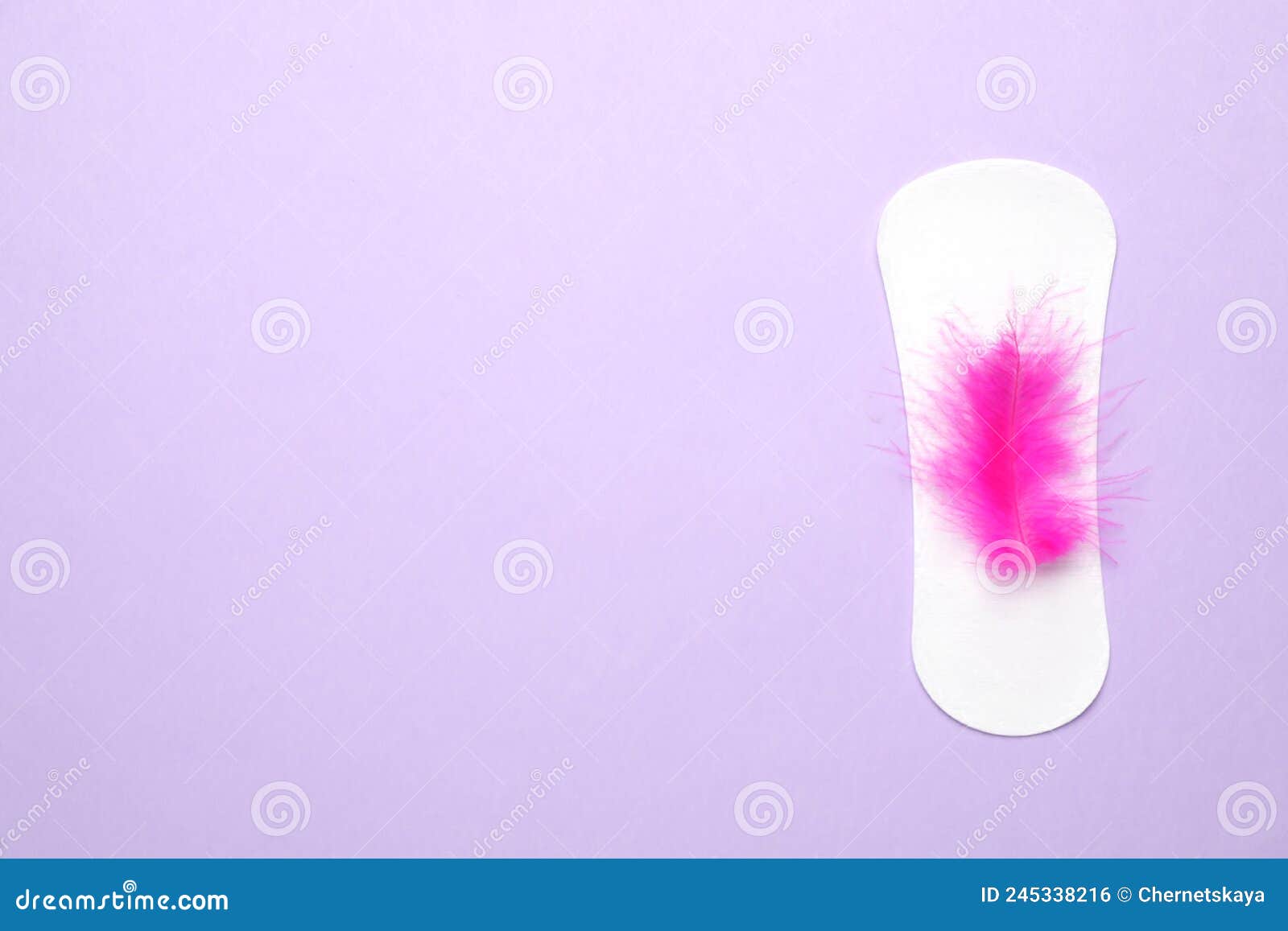 Sanitary Pad with Pink Feather on Violet Background, Top View and Space ...