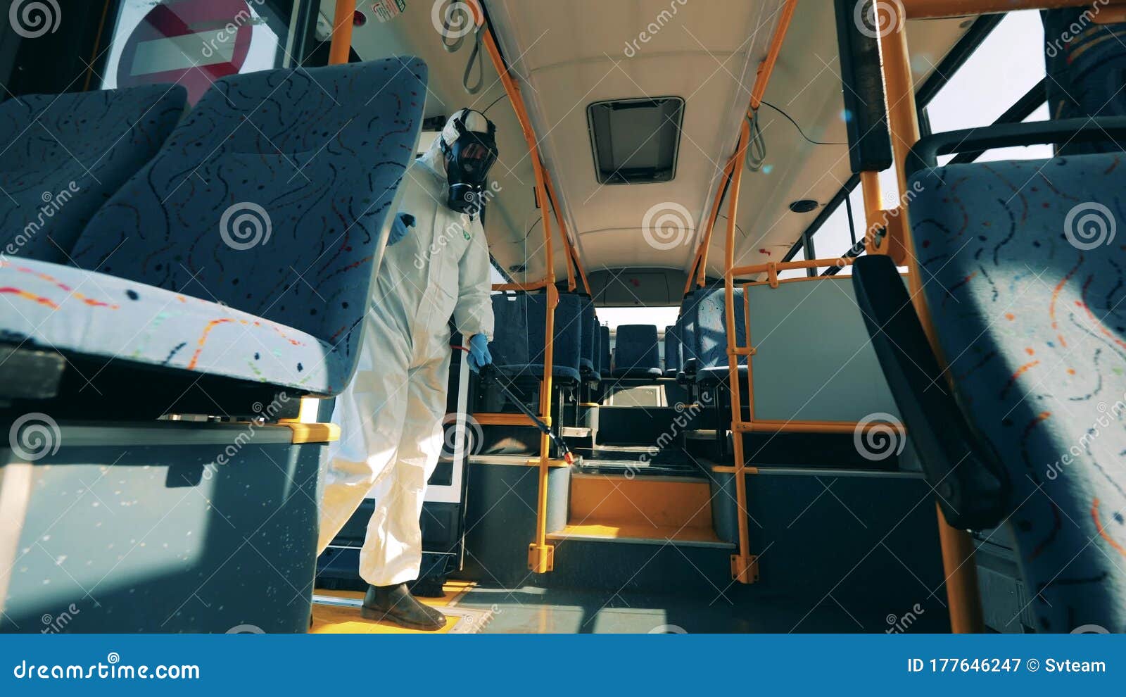 Sanitation Worker is Entering a Bus and Sanitizing it Stock Video ...