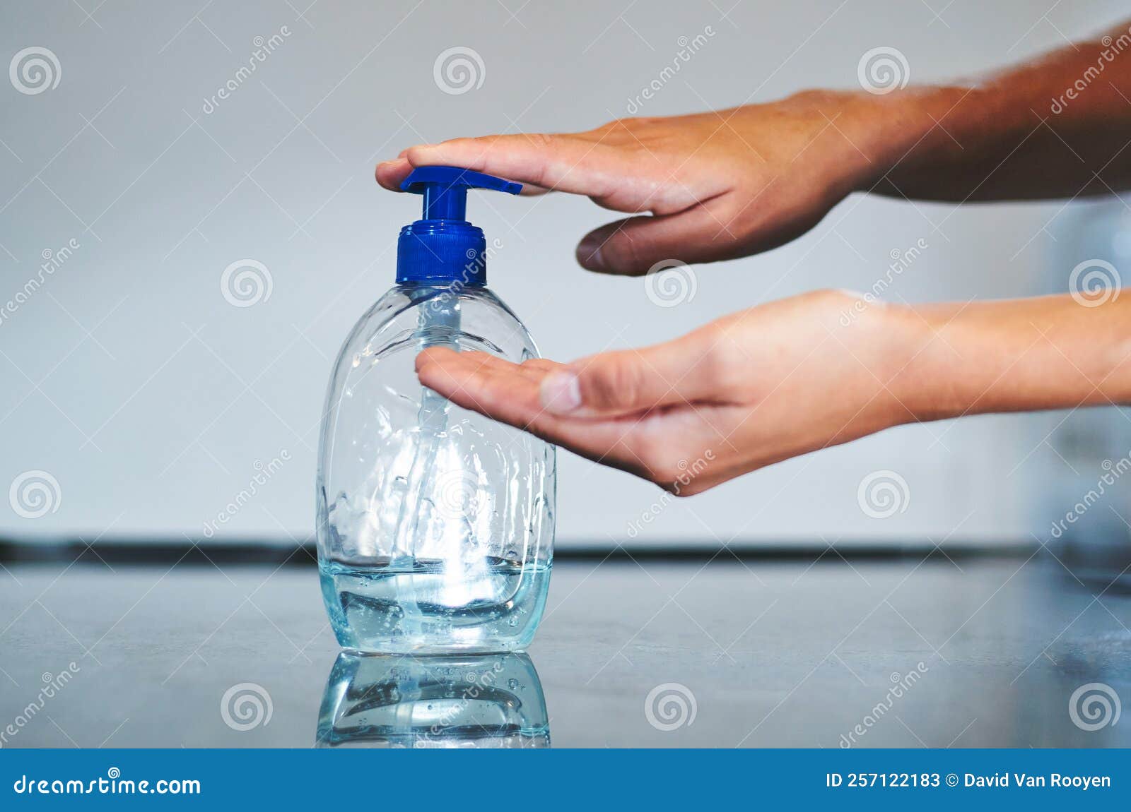 Sanitizing Hands with Liquid Gel Dispenser Stock Image - Image of ...