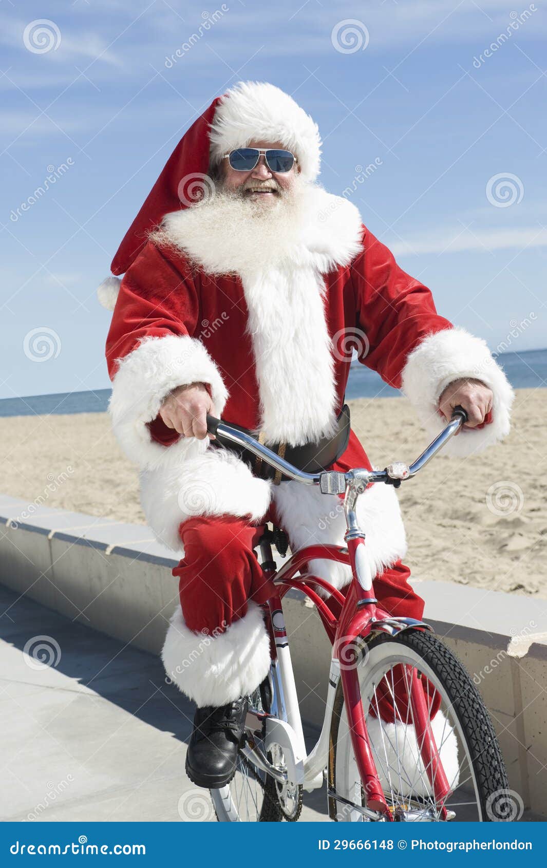 Santa Claus Cycling by Beach Stock Photo - Image of merry, looking ...