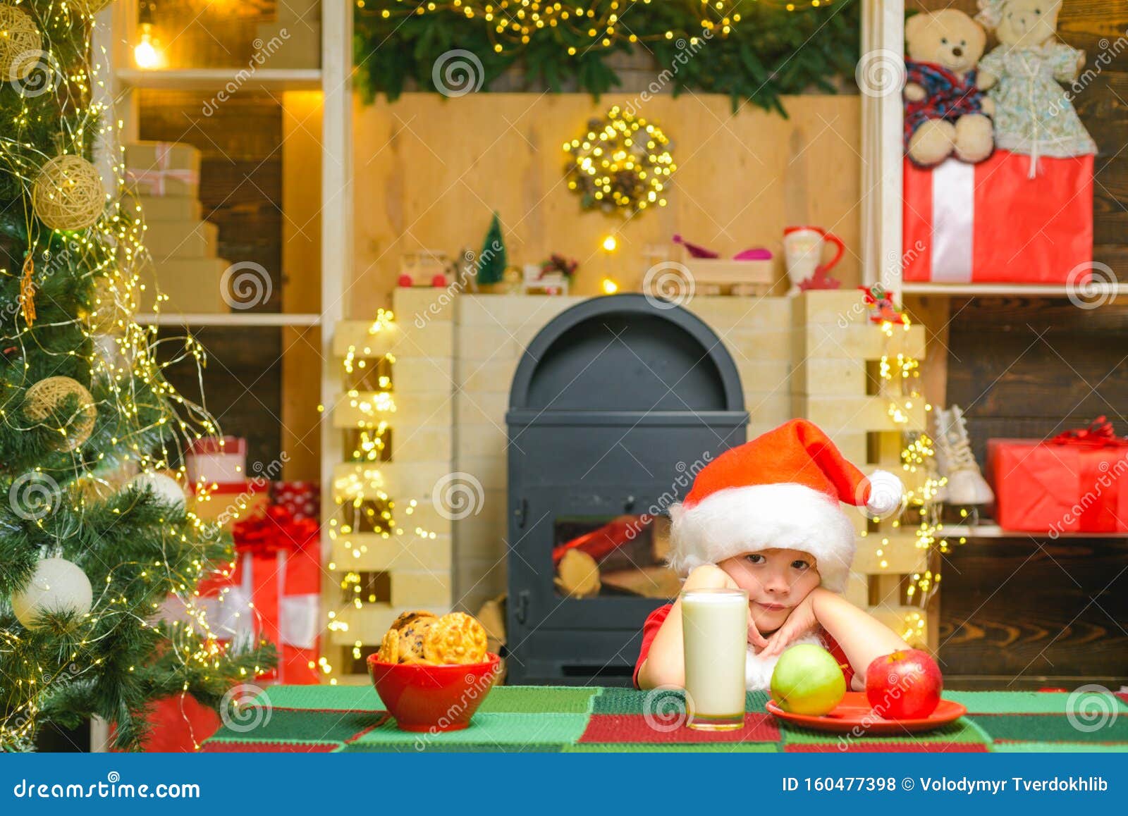 Santa Claus Enjoys Cookies And Milk Left Out For Him On Christmas Eve