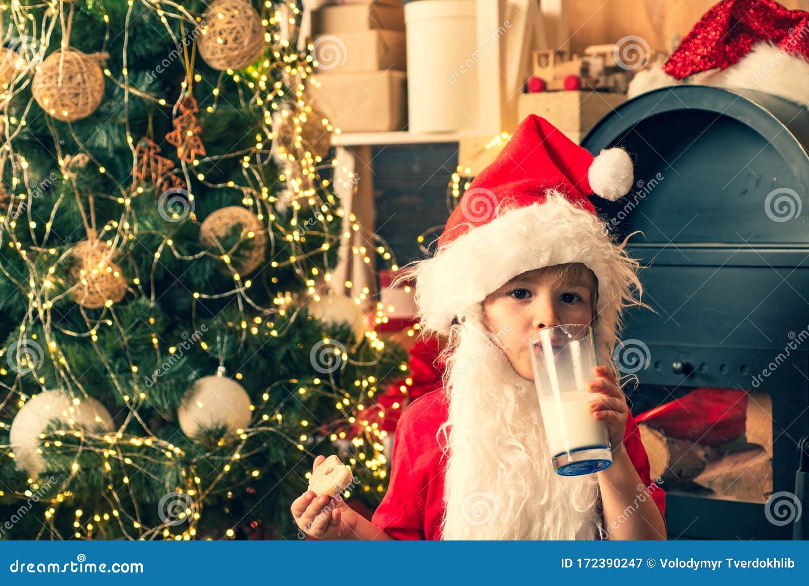 Santa Claus Enjoys Cookies And Milk Left Out For Him On Christmas Eve