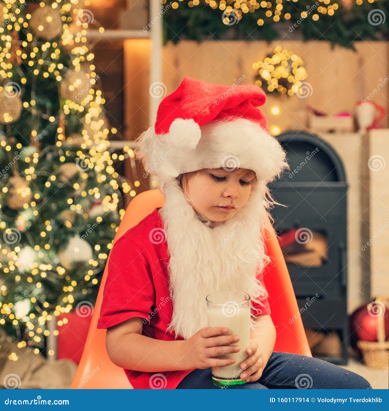 Santa Claus Enjoys Cookies And Milk Left Out For Him On Christmas Eve